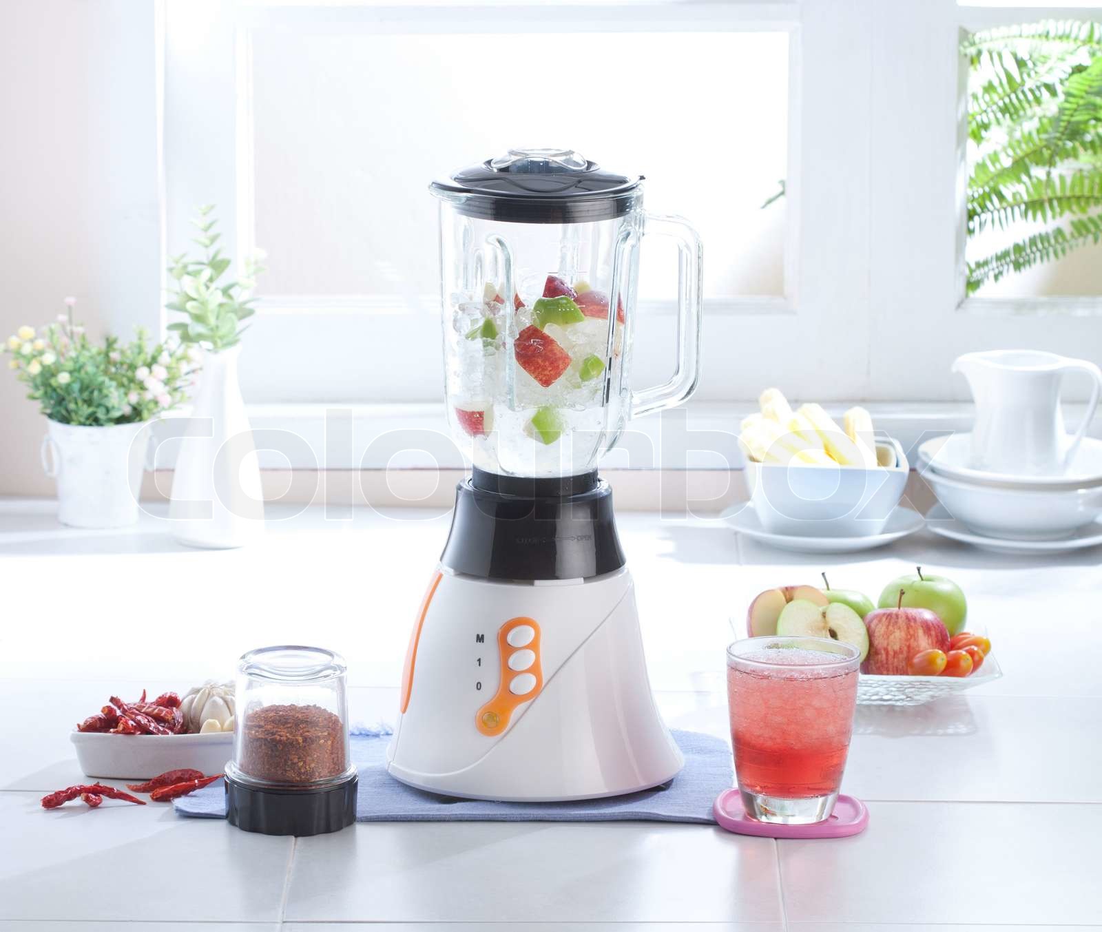 Fruits and vegetables blender machine tool in the kitchen interior ...