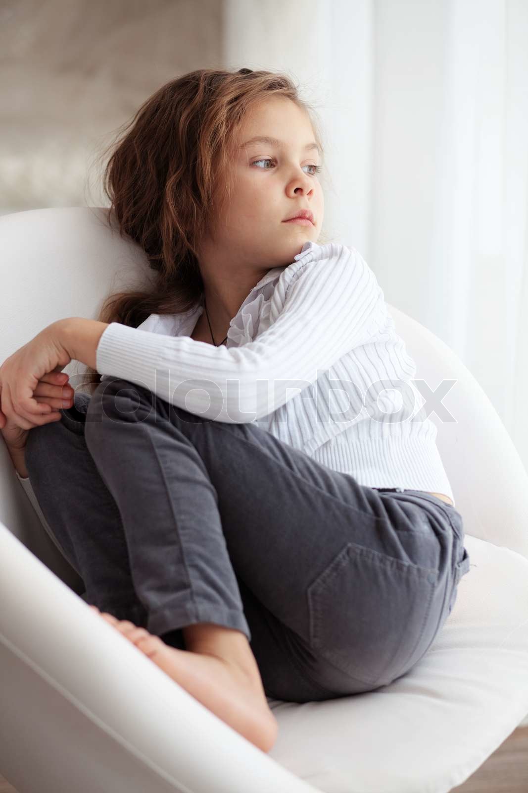 Child on a chair | Stock image | Colourbox