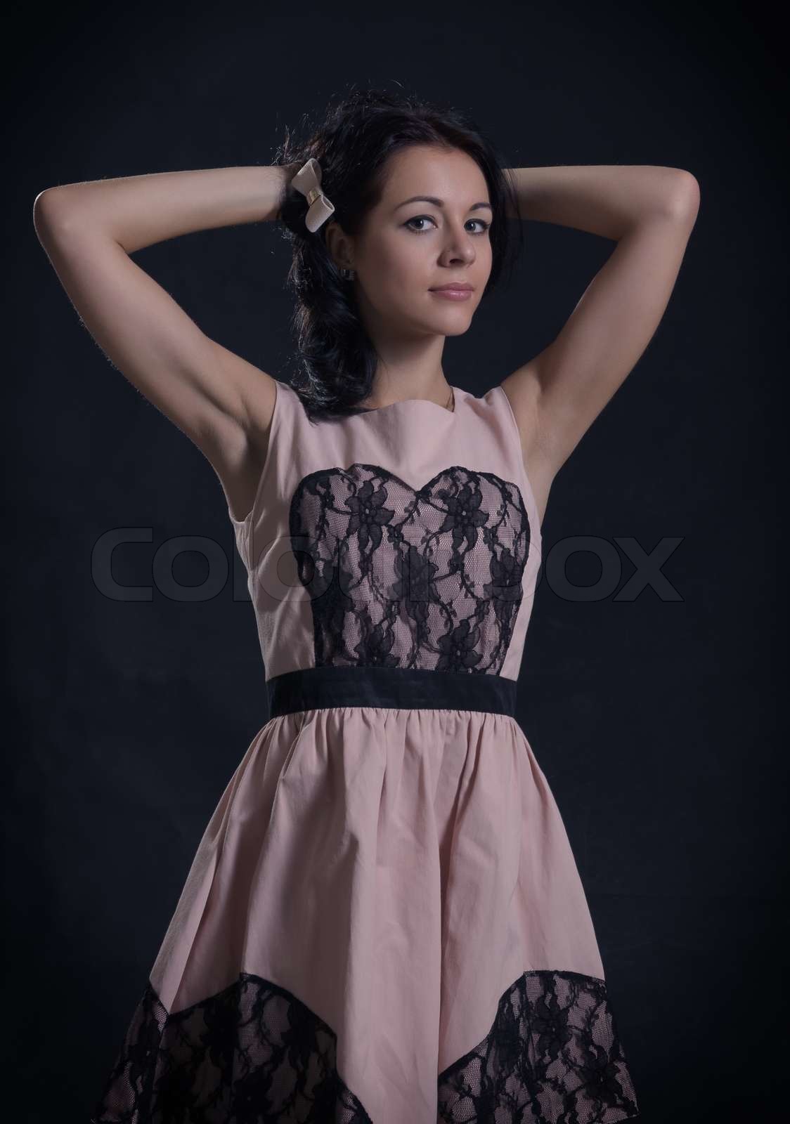 Attractive woman with arms raised | Stock image | Colourbox