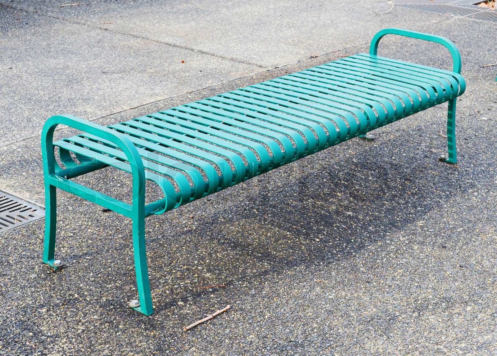 Empty green metal bench | Stock image | Colourbox