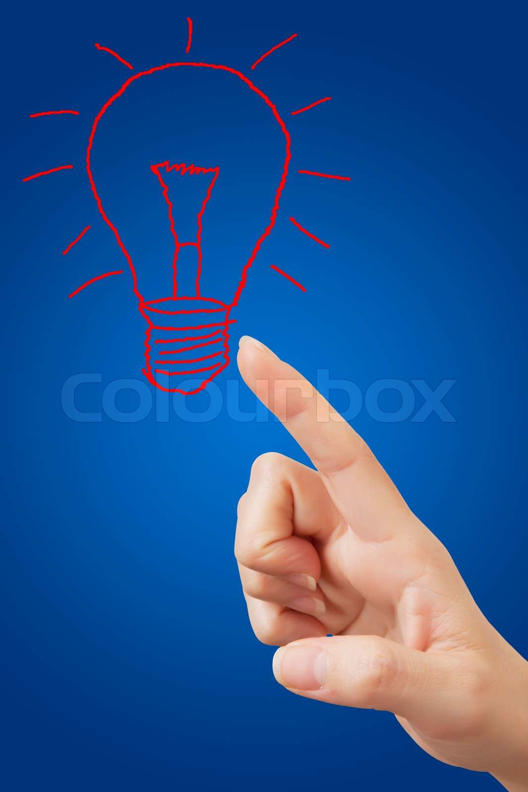 Finger pointing to a light bulb | Stock image | Colourbox