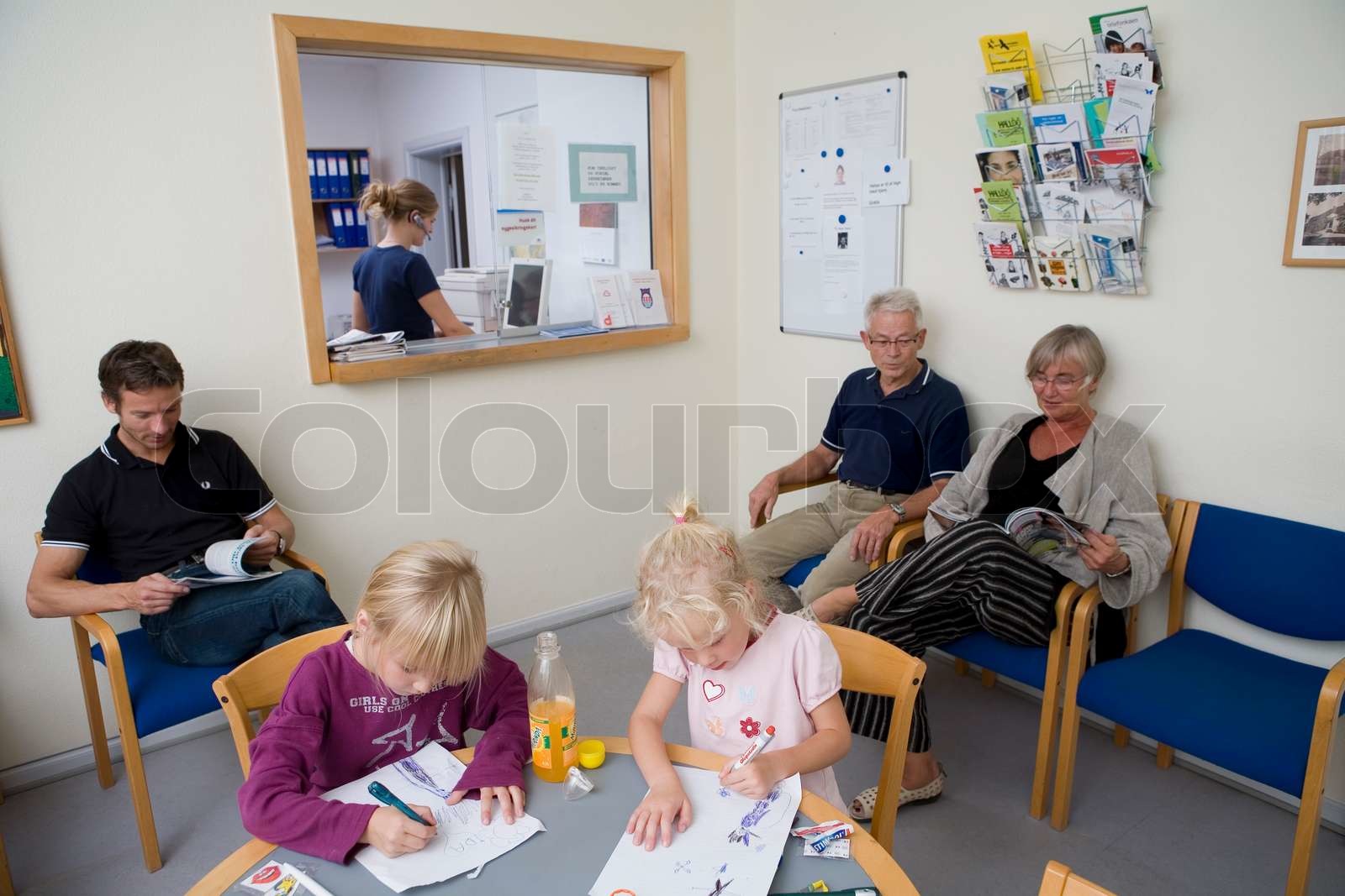 A caucasian family in a clinic's waiting room | Stock image | Colourbox