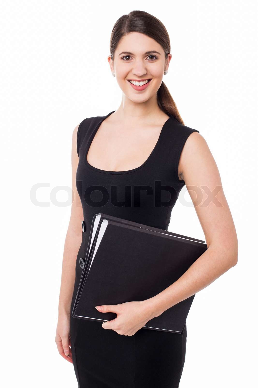 Pretty female secretary holding business files | Stock image | Colourbox