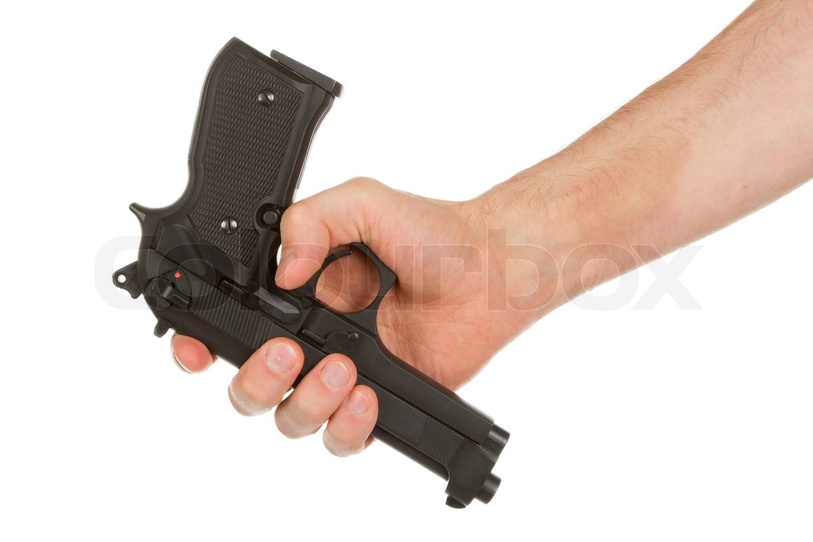Disarming, hand giving a gun | Stock image | Colourbox