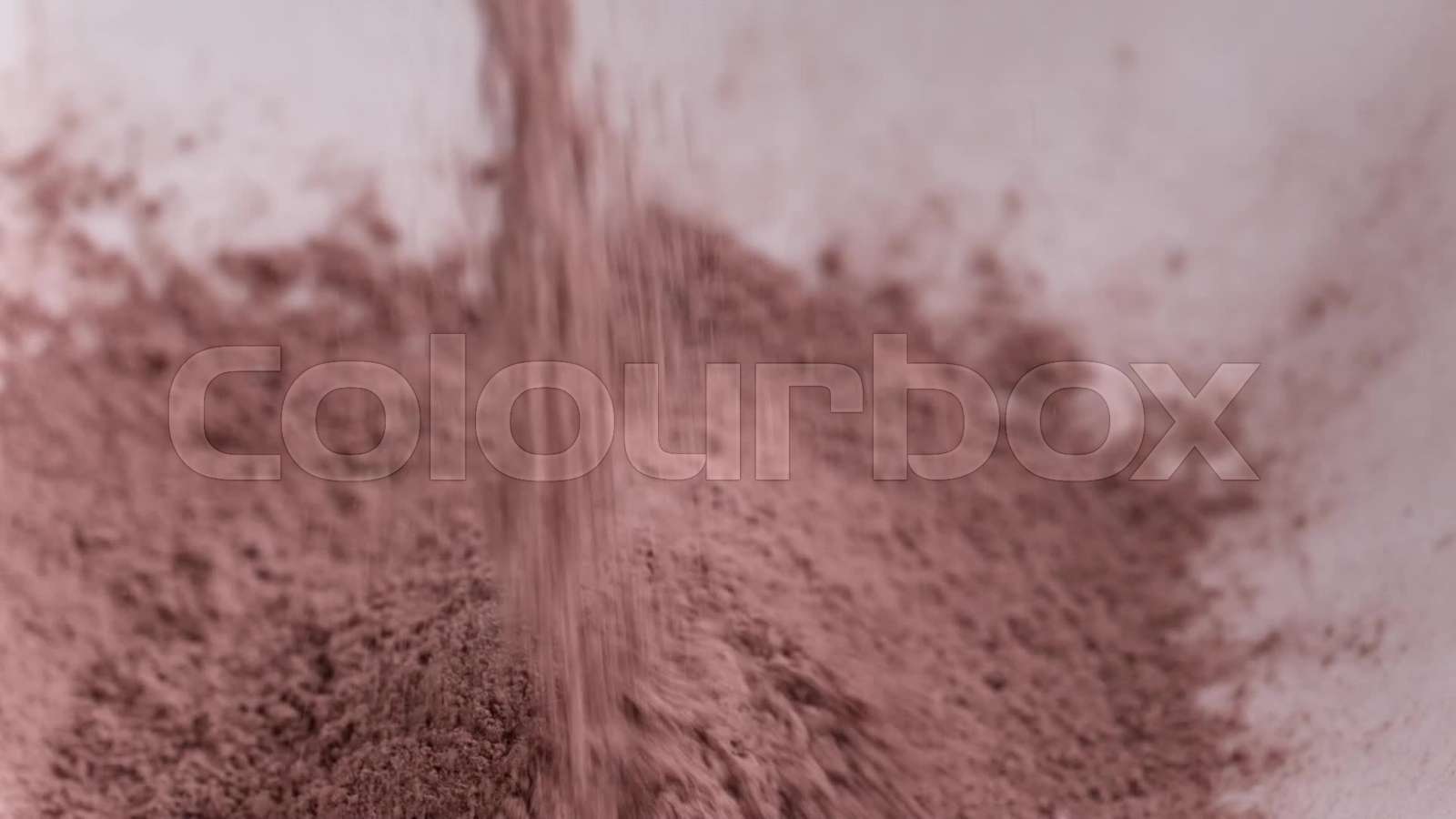 Cocoa powder pouring in plate | Stock video | Colourbox