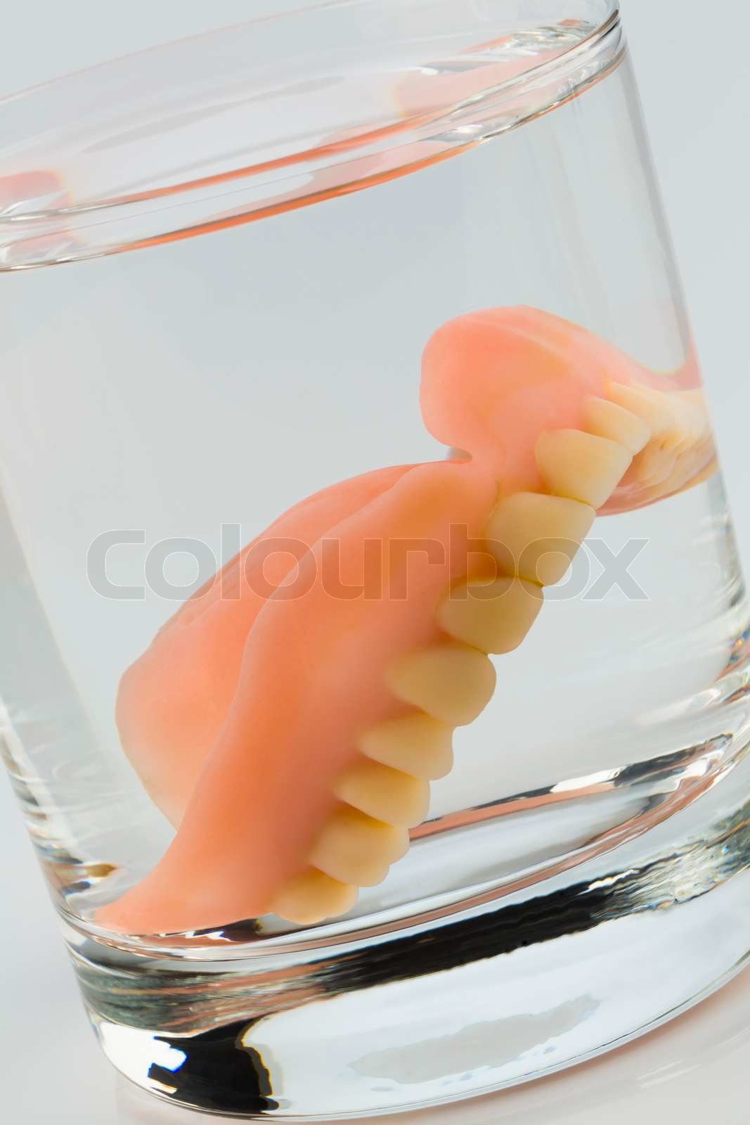 dentures in a water glass | Stock image | Colourbox