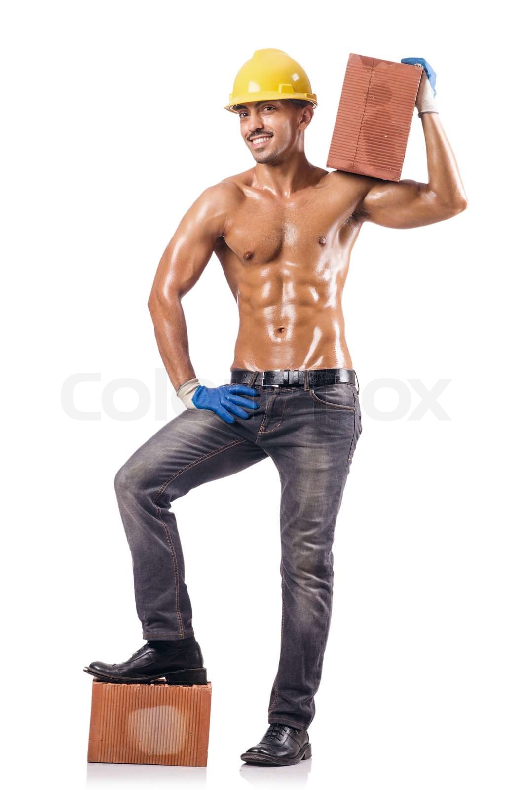 Sexy construction worker with bricks | Stock image | Colourbox