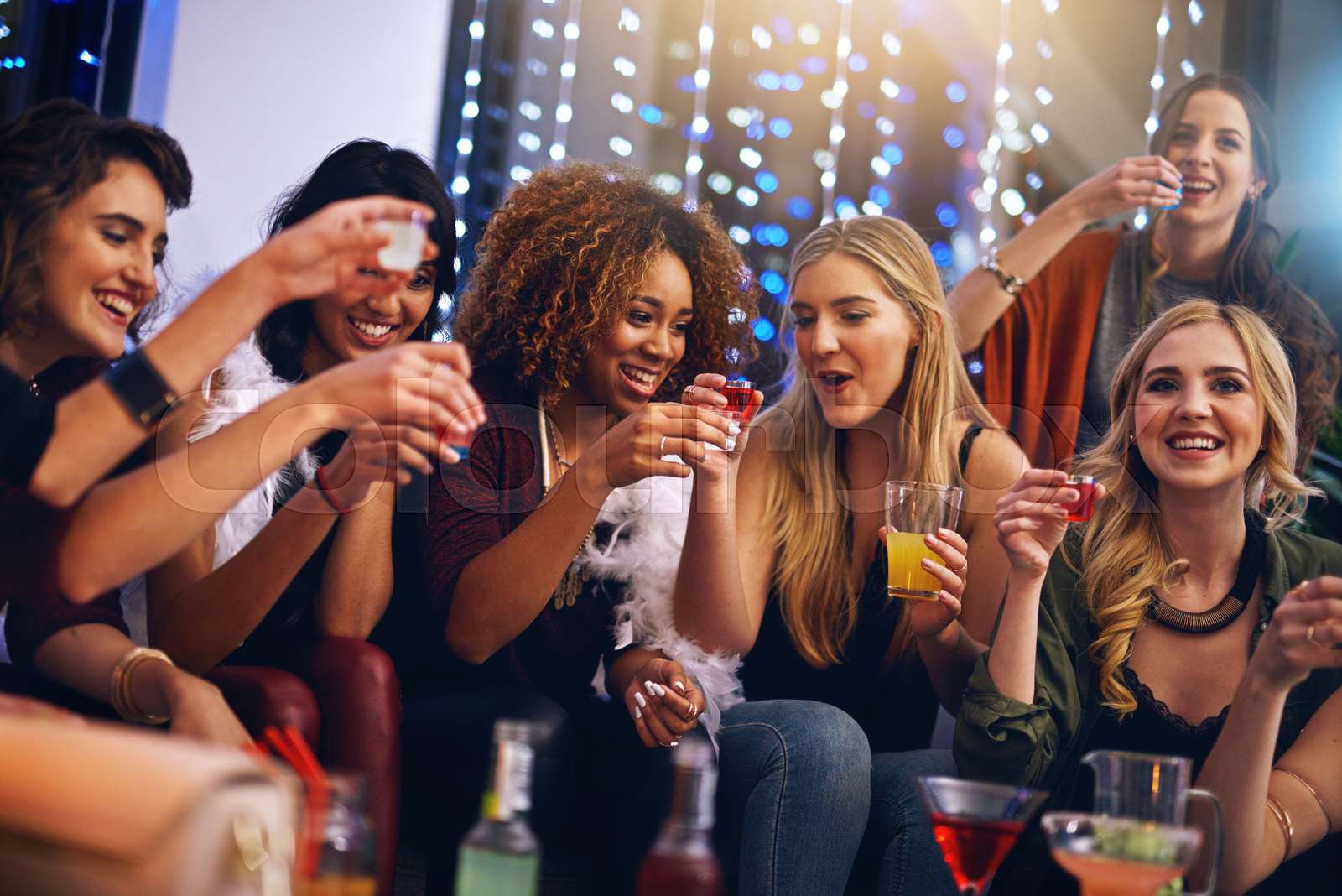 Party, nightclub and friends with alcohol shots for birthday ...