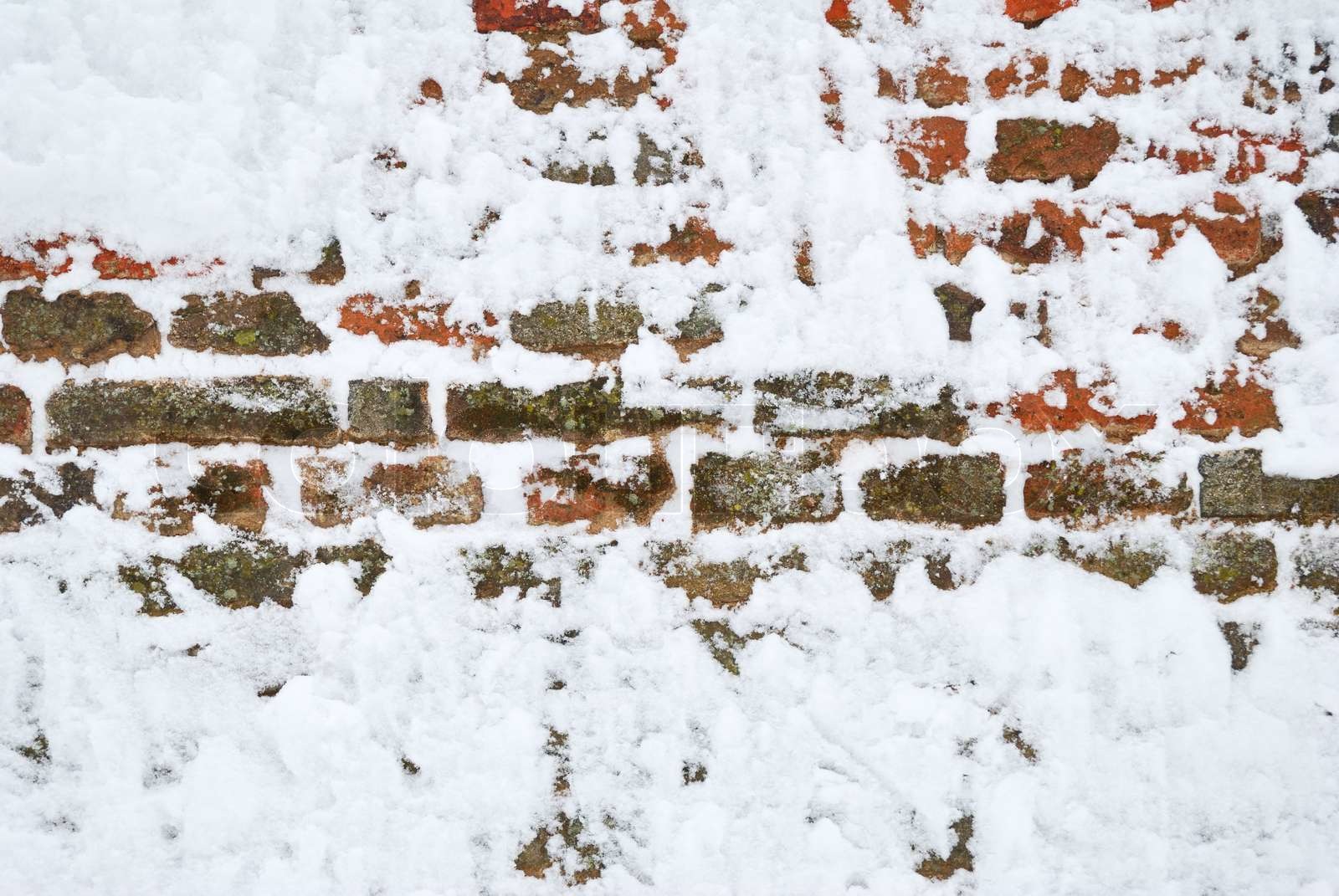 Brick wall covered in heavy snow | Stock image | Colourbox