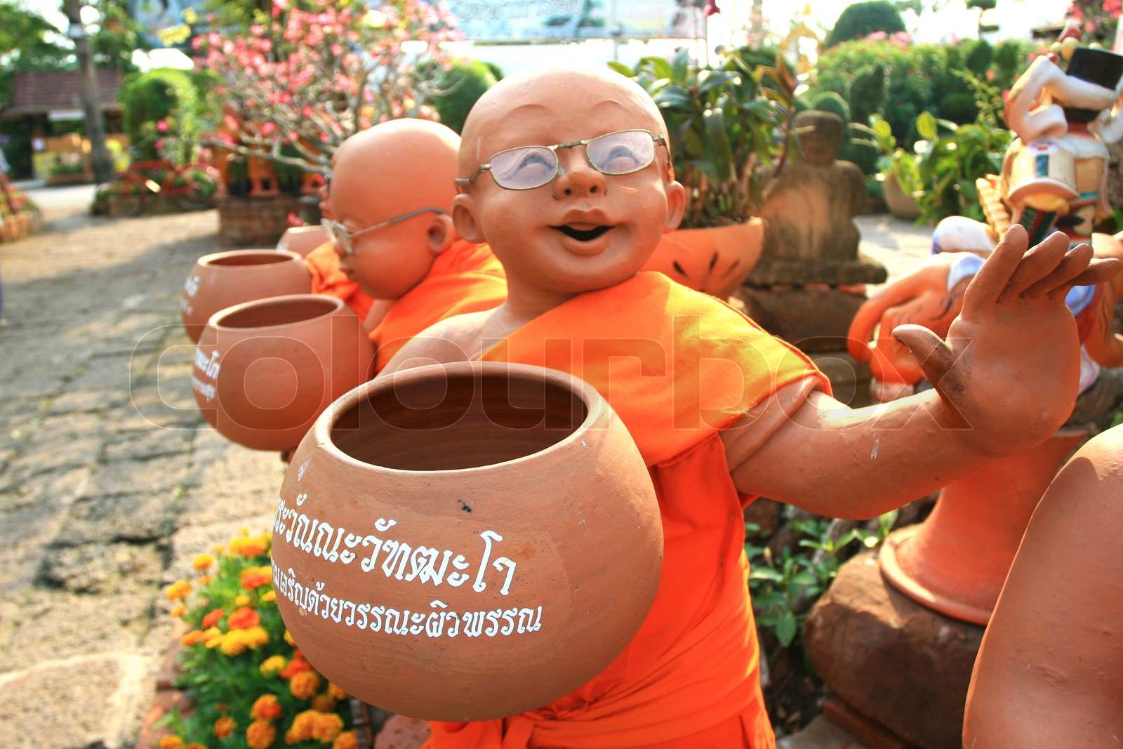 Buddhist statues smile | Stock image | Colourbox