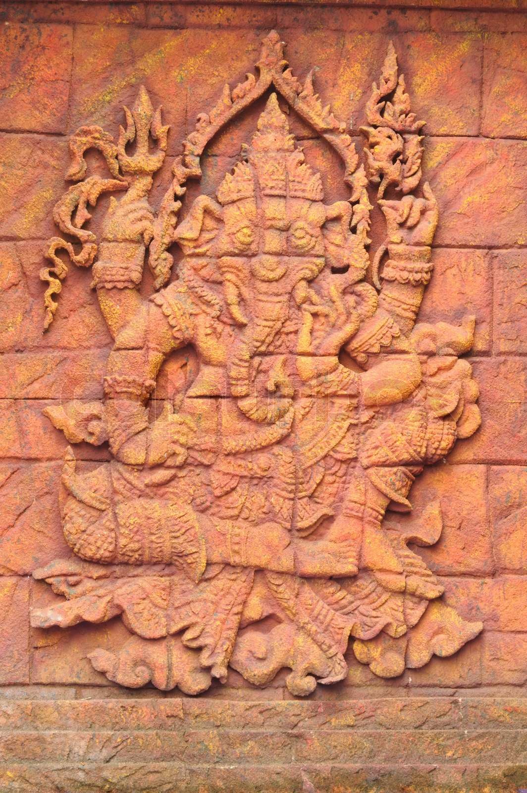 A stone carved sculpturee statue of an Indian god | Stock image | Colourbox