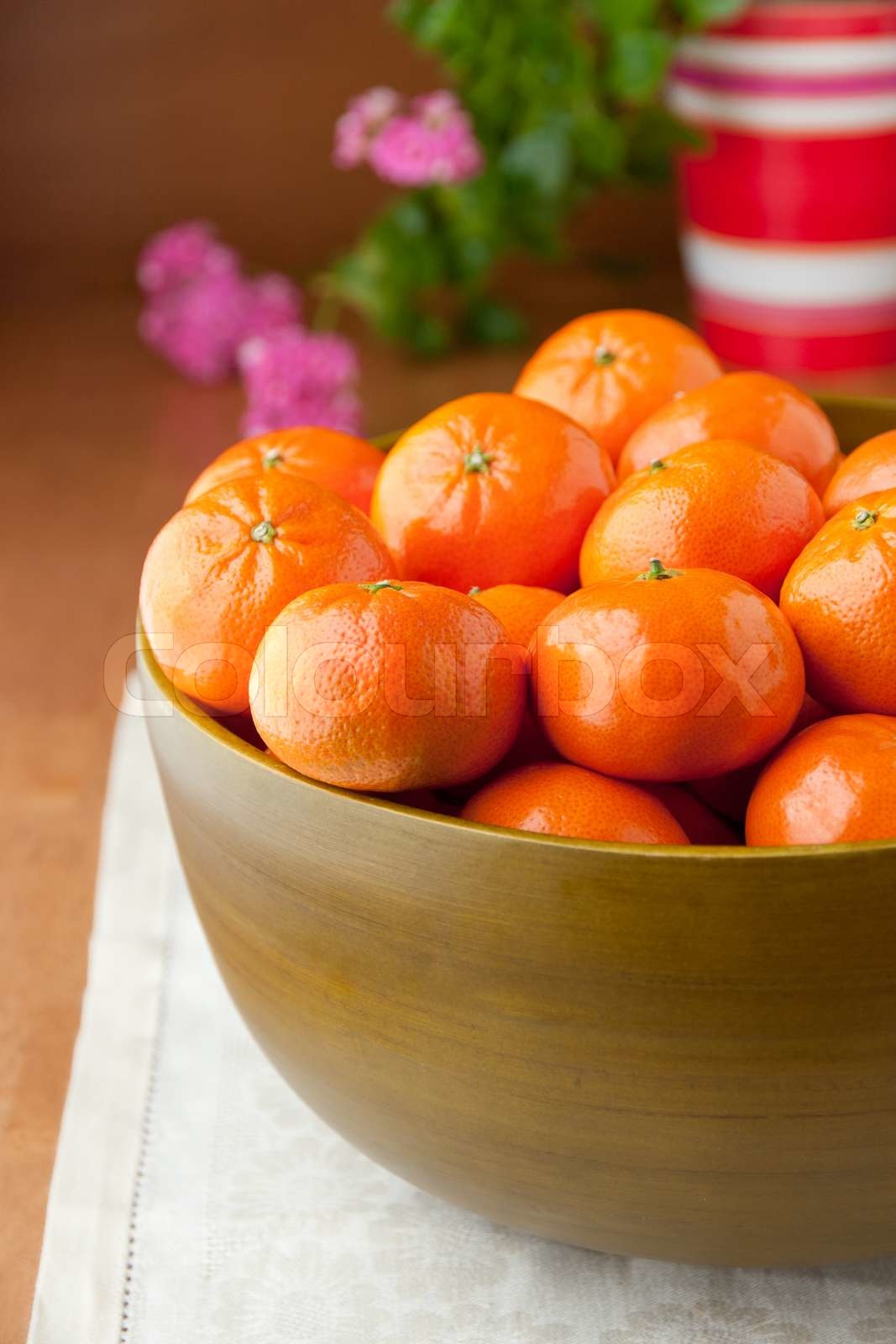 Fresh mandarin oranges in big wooden bowl | Stock image | Colourbox