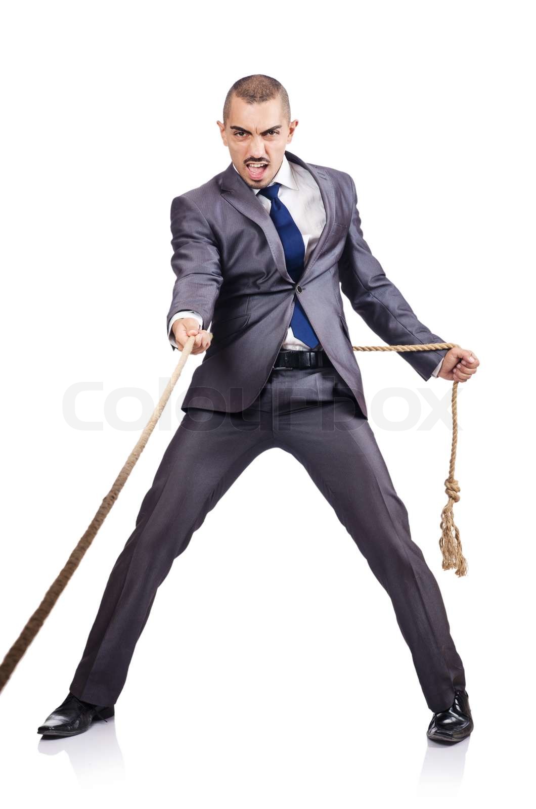 Man pulling the rope on white | Stock image | Colourbox