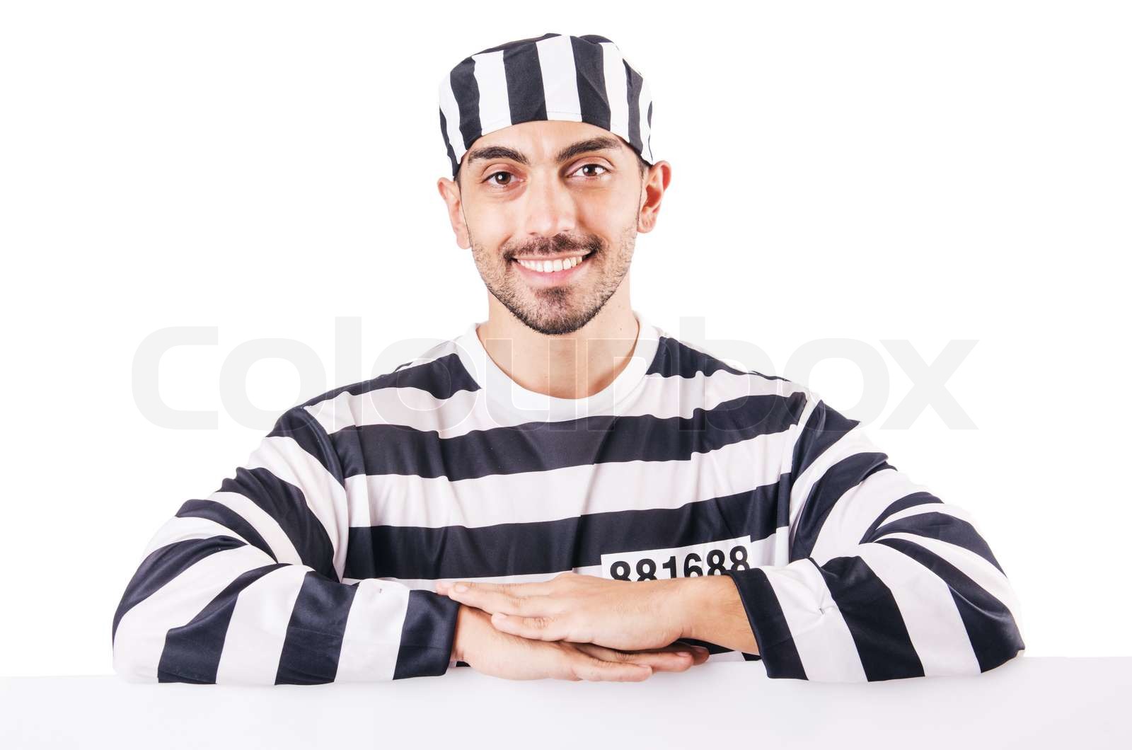 Convict criminal in striped uniform | Stock image | Colourbox