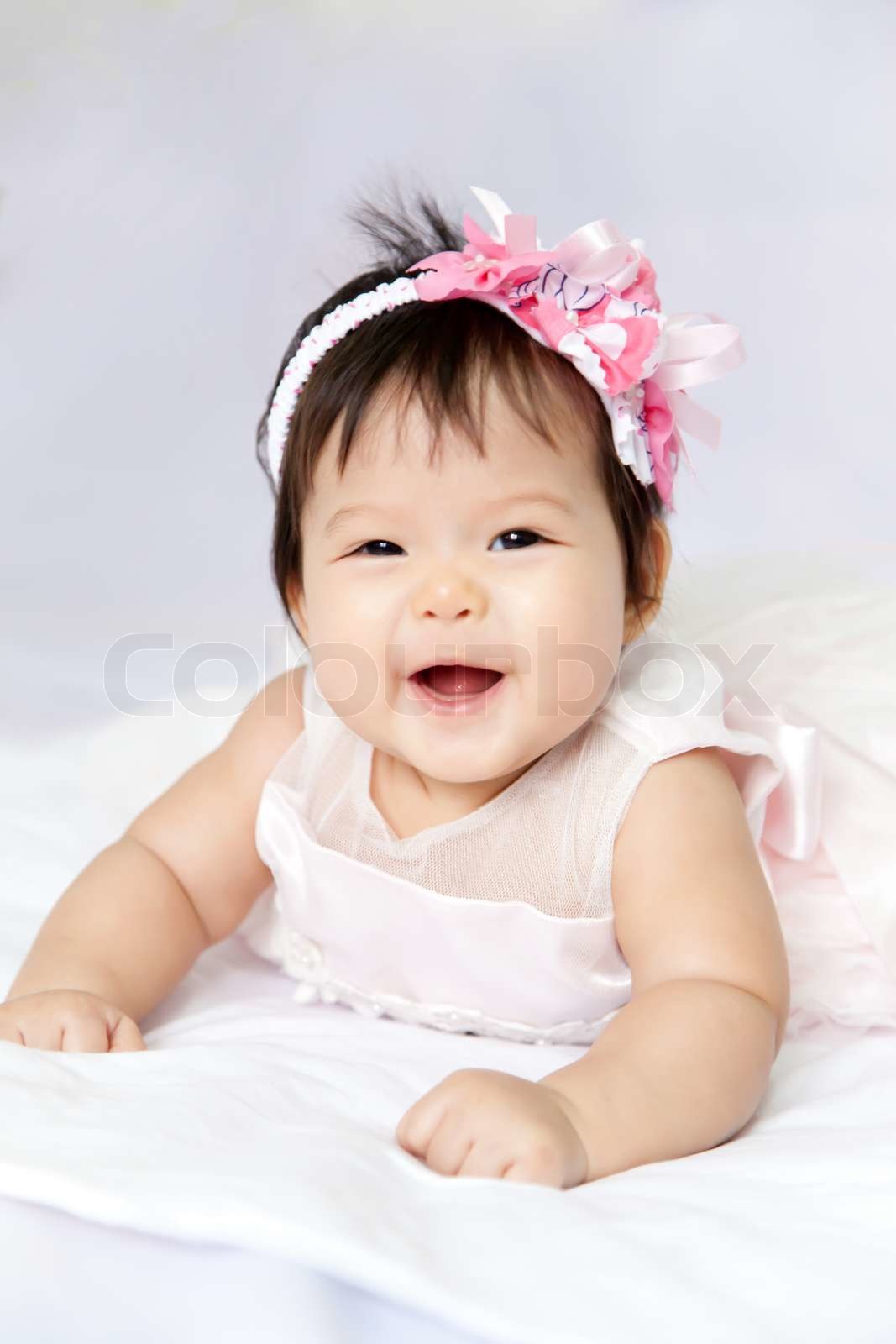 Baby is smiling and happy | Stock image | Colourbox