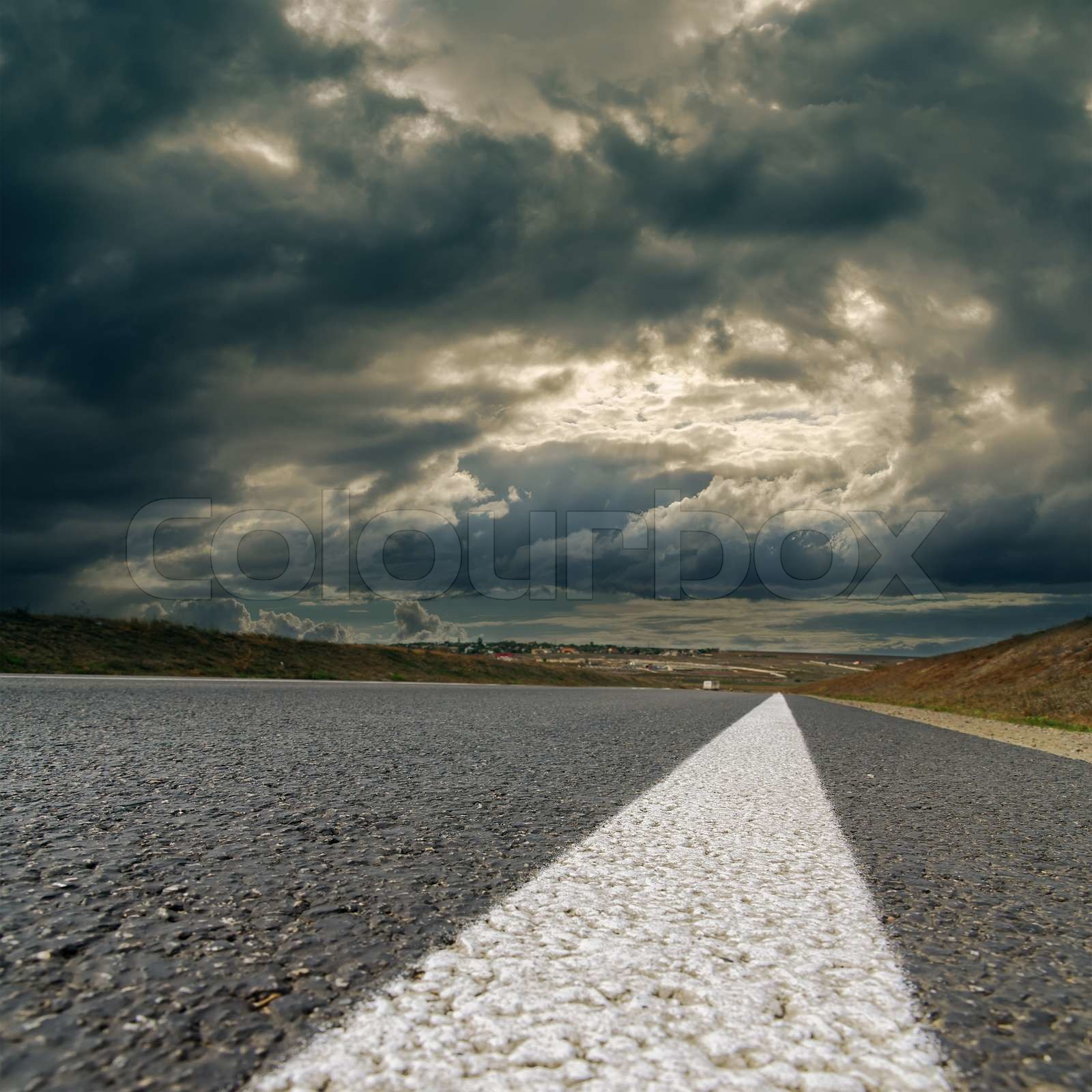 dramatic sky over asphalt road | Stock image | Colourbox