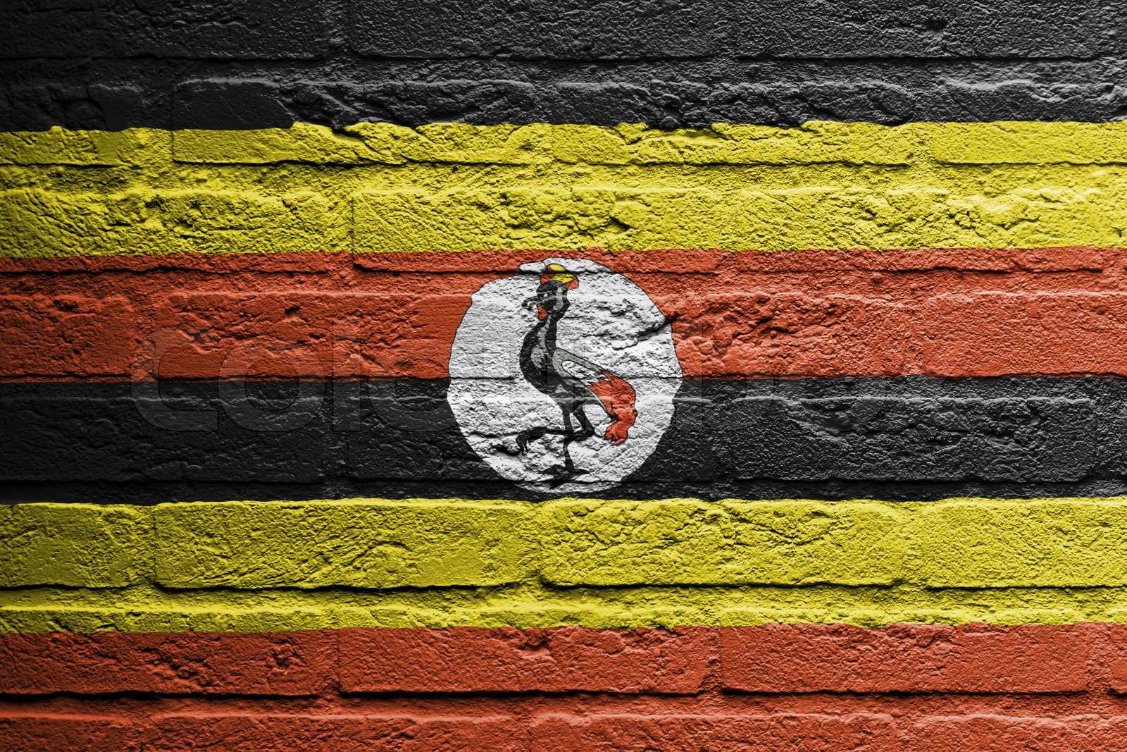 Brick wall with a painting of a flag, Uganda | Stock image | Colourbox