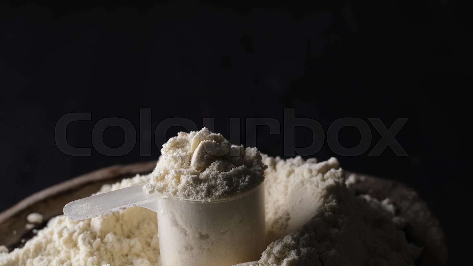 Dry whey protein in a measuring spoon. | Stock video | Colourbox