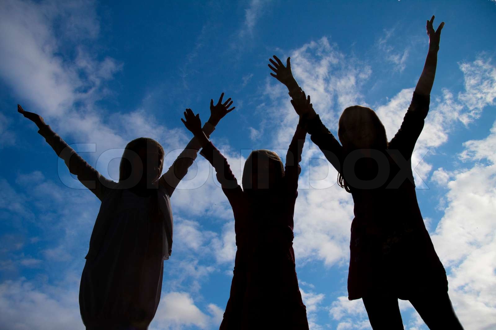 Happy children with hands in the air | Stock image | Colourbox