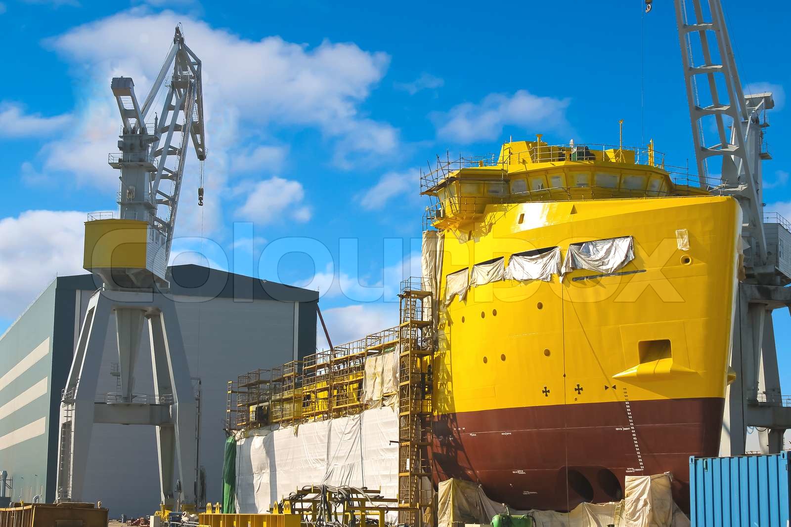 The Construction Of A New Ship In Dry Dock Shipyard Stock Image the-construction-of-a-new-ship-in-dry-dock-shipyard-stock-image