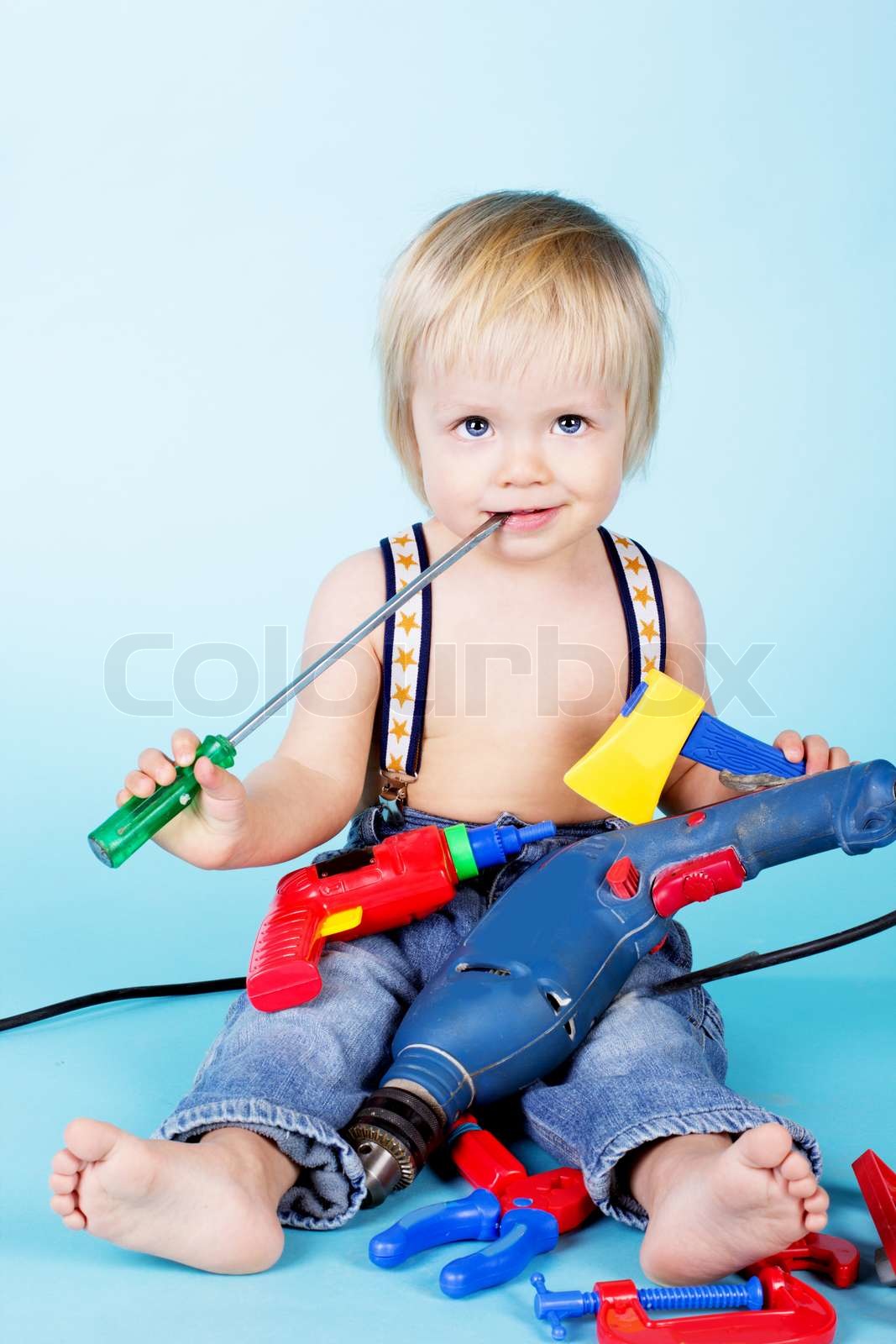Little baby boy play with build tools | Stock image | Colourbox