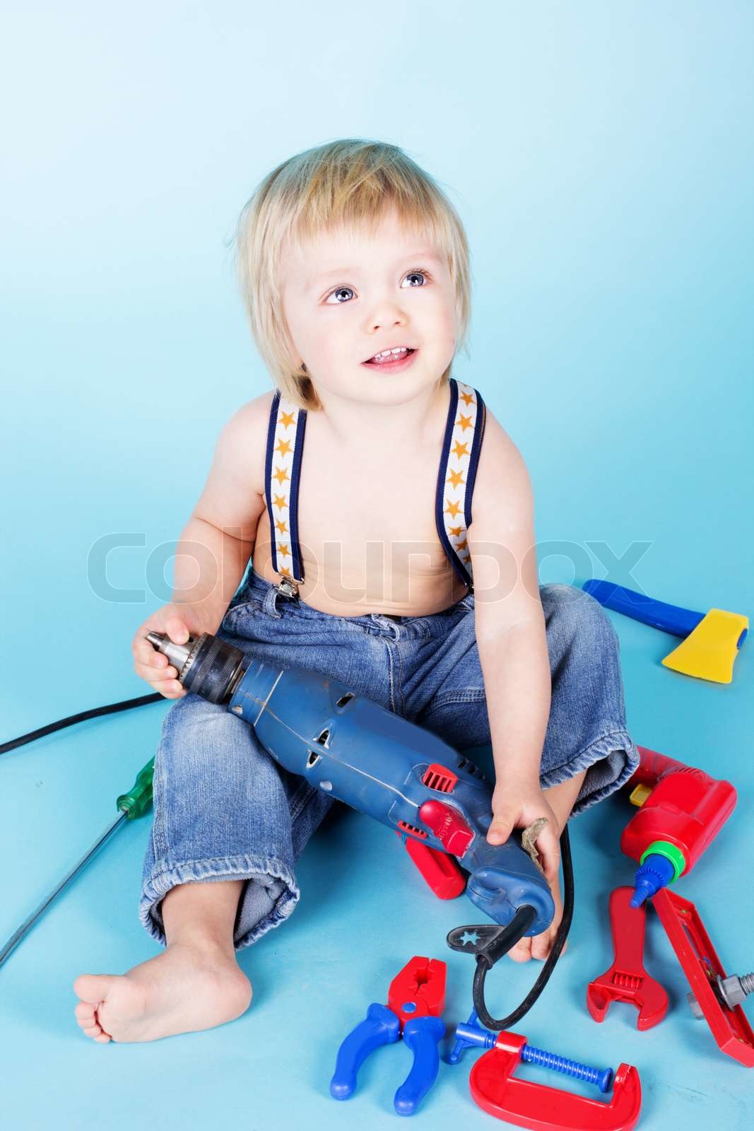 Little baby boy play with build tools | Stock image | Colourbox