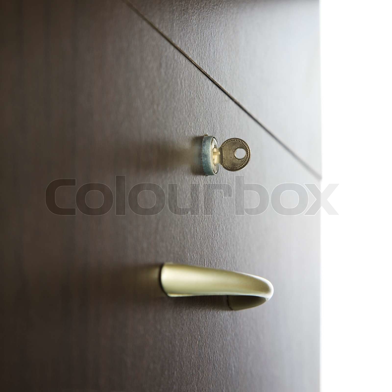 Close-up of a drawer with keys in lock | Stock image | Colourbox