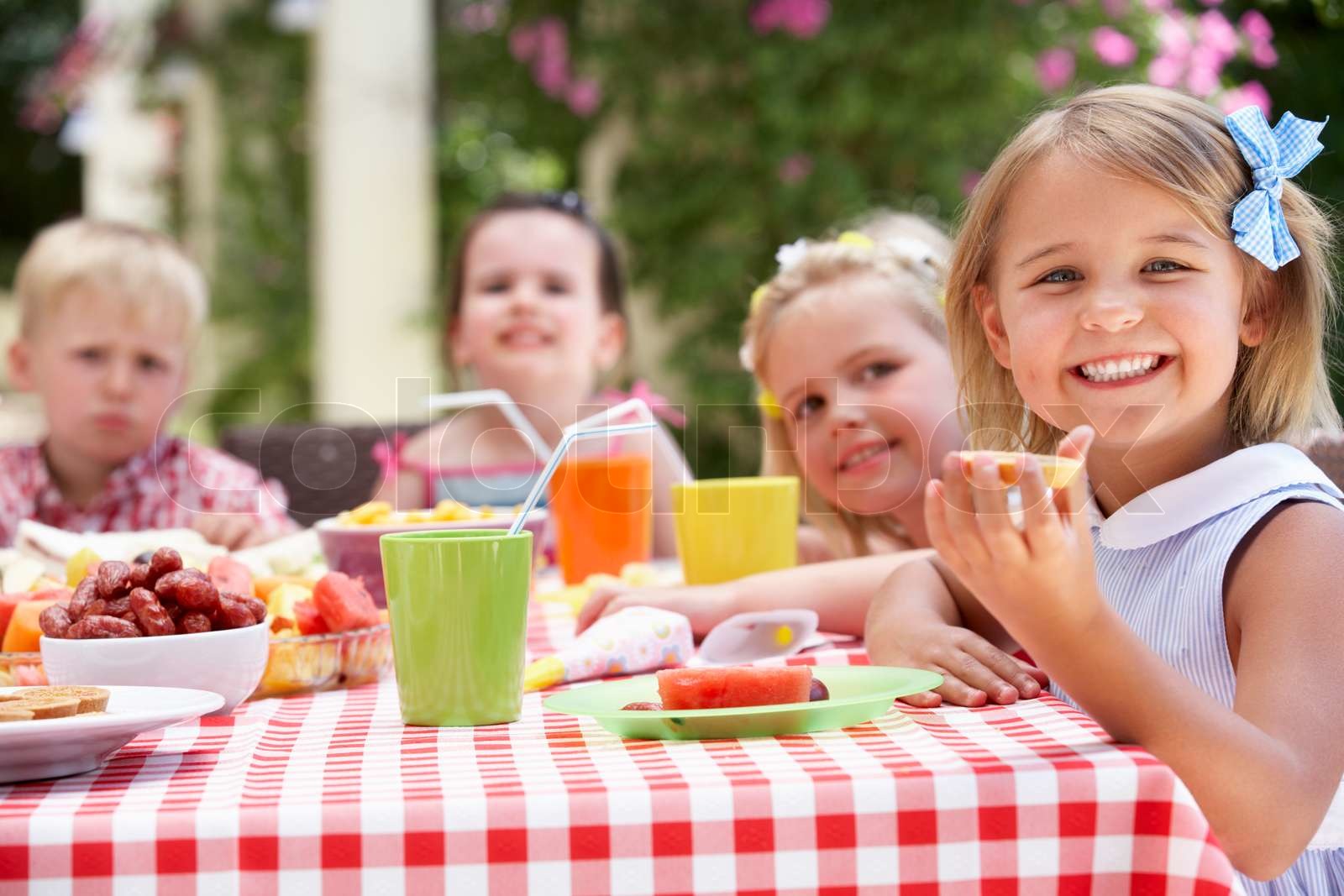 Group Of Children Enjoying Outdoor Tea Party | Stock image | Colourbox