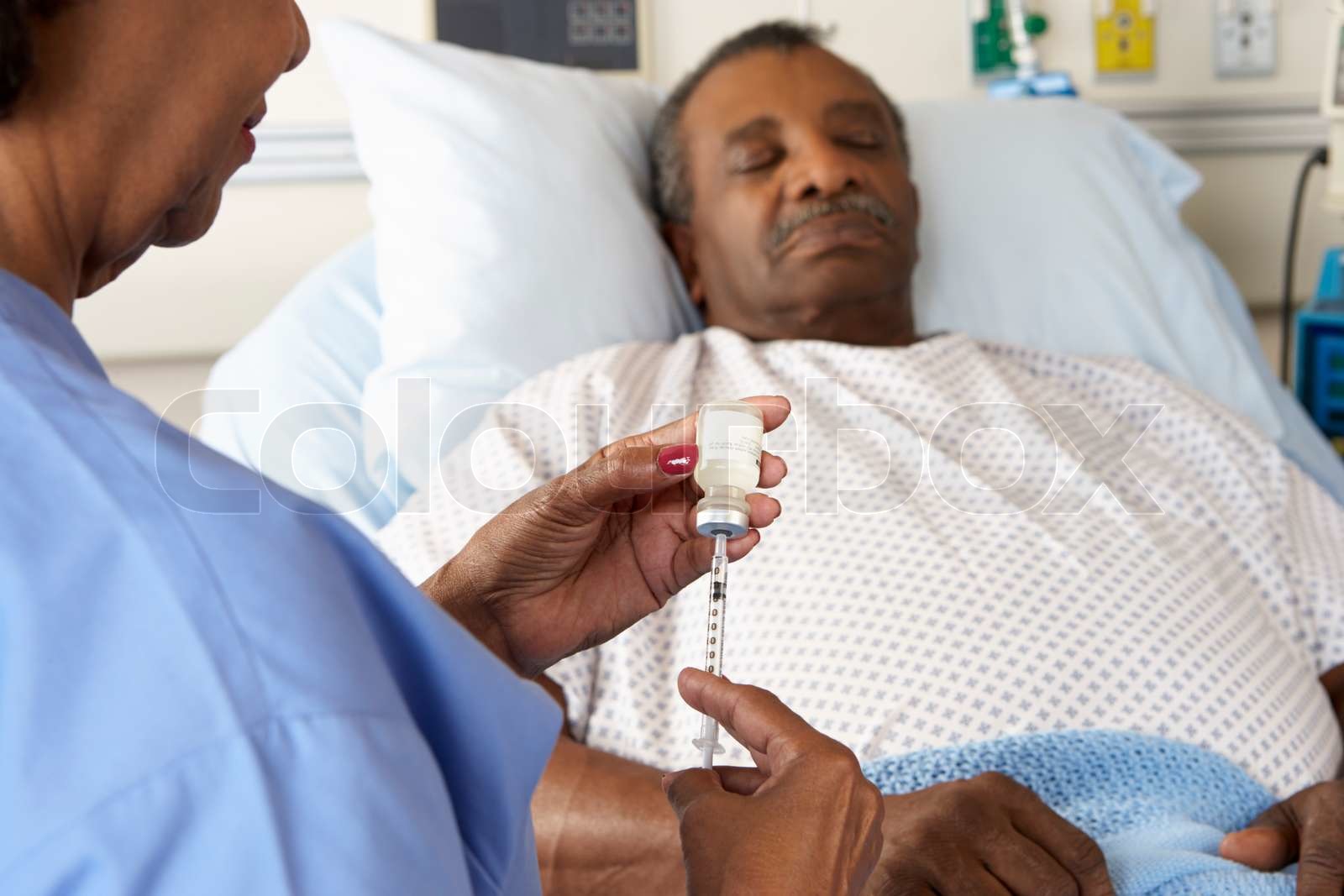 Nurse Preparing To Give Senior Male Patient Injection | Stock image ...