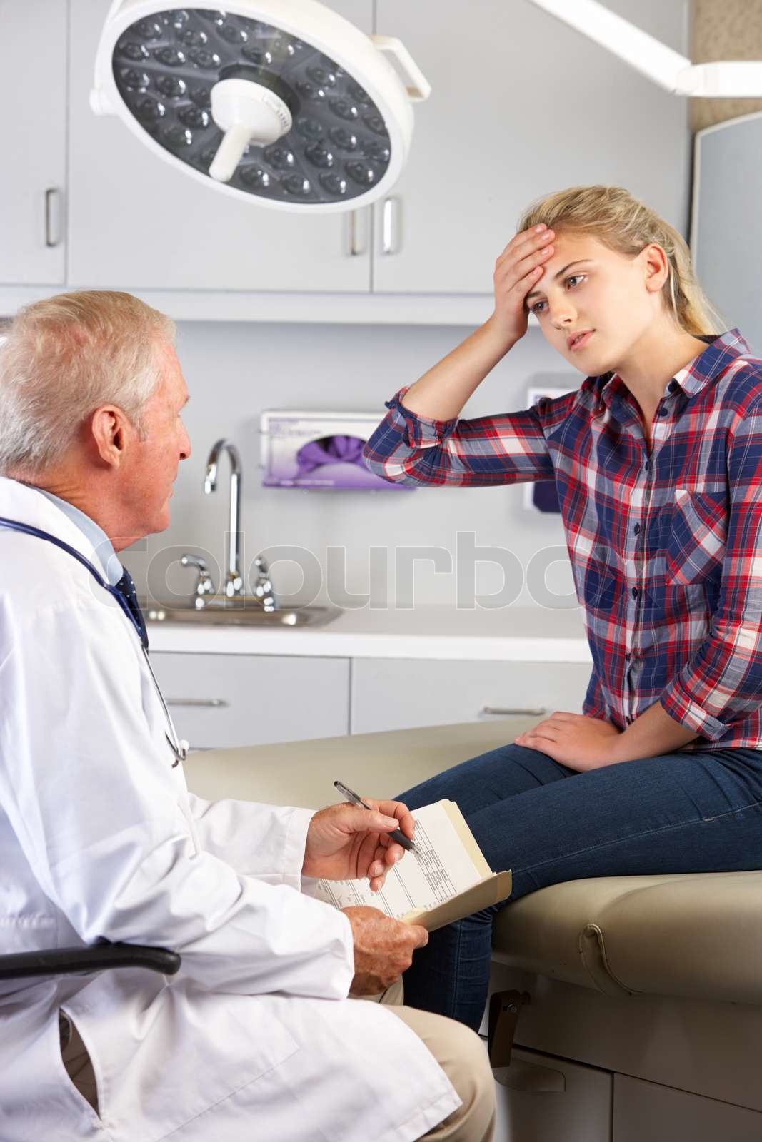 Teenage Girl Visits Doctor's Office With Headaches | Stock image ...