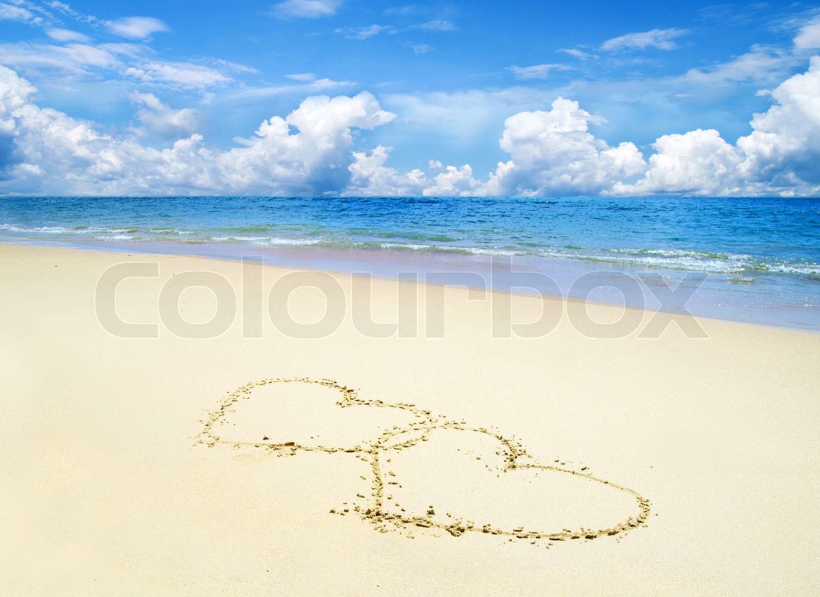 hjerter tegnet i sandet | Stock foto | Colourbox