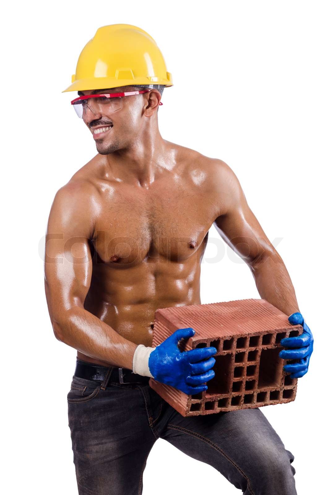 Muscular builder with bricks on white | Stock image | Colourbox
