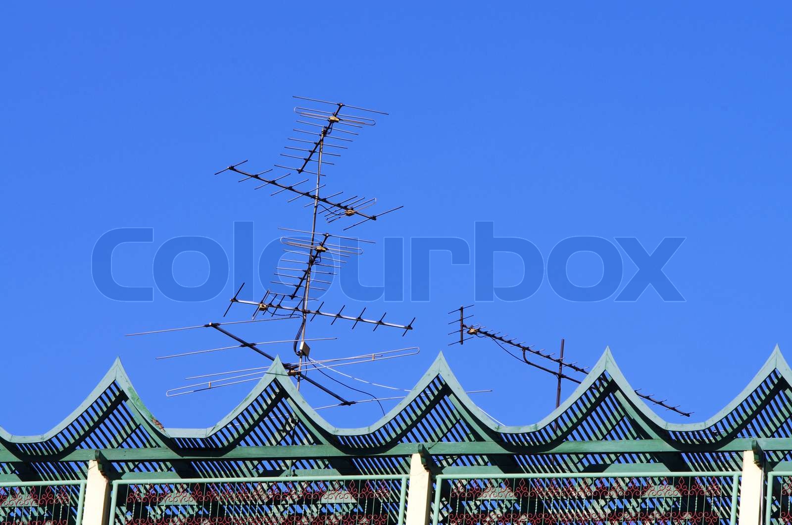 Fish-bone Antennas on blue sky | Stock image | Colourbox