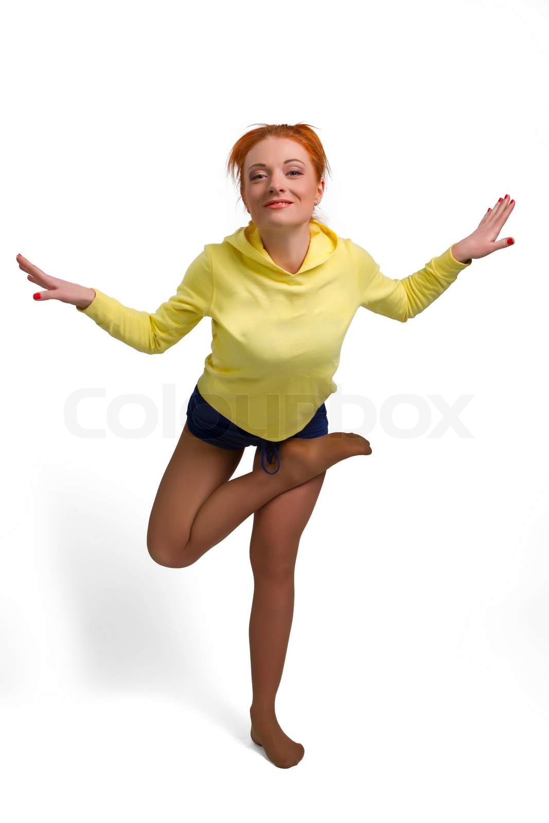 woman stand on one leg in yoga pose Isolated | Stock image | Colourbox