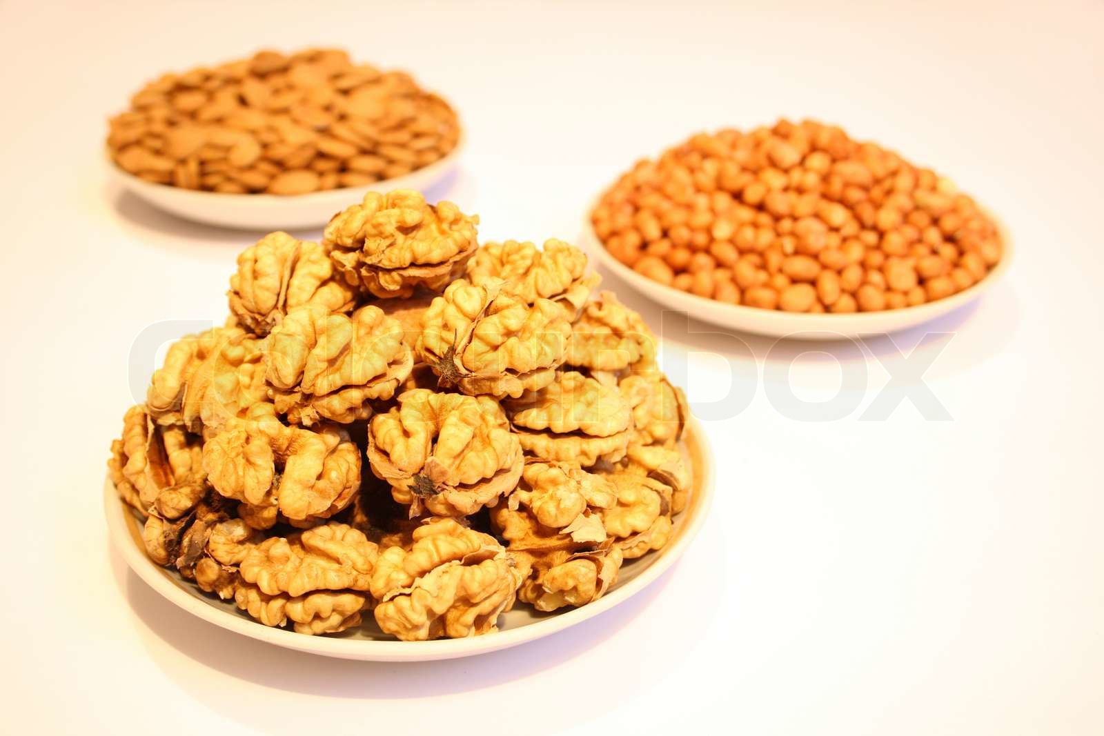 nuts in a plates | Stock image | Colourbox