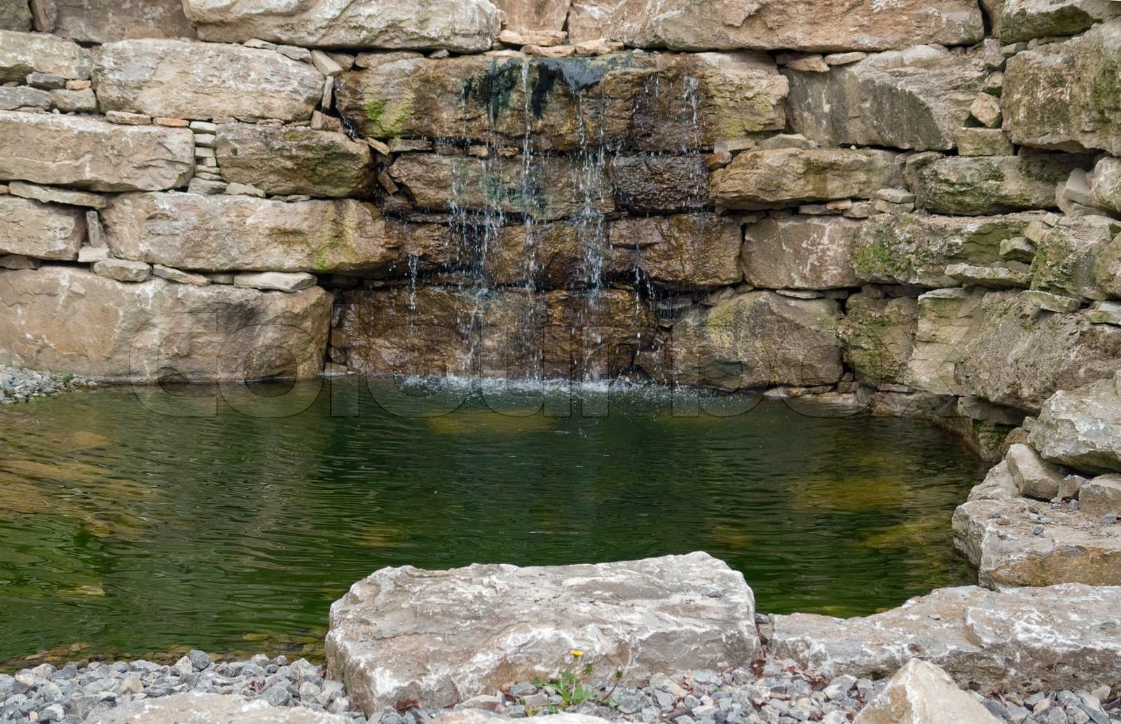 stone wall and pond detail | Stock image | Colourbox