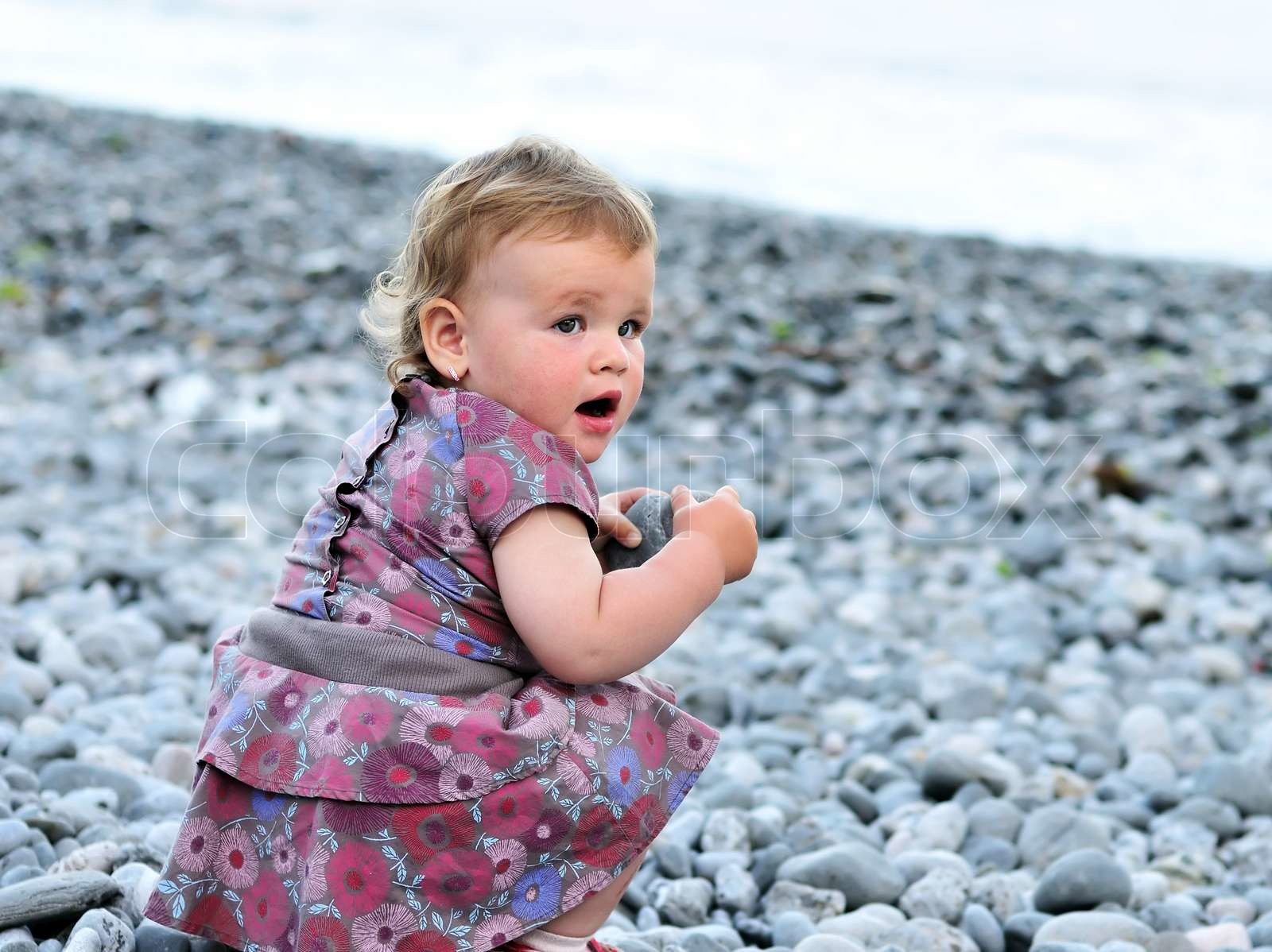 baby with pebble | Stock image | Colourbox