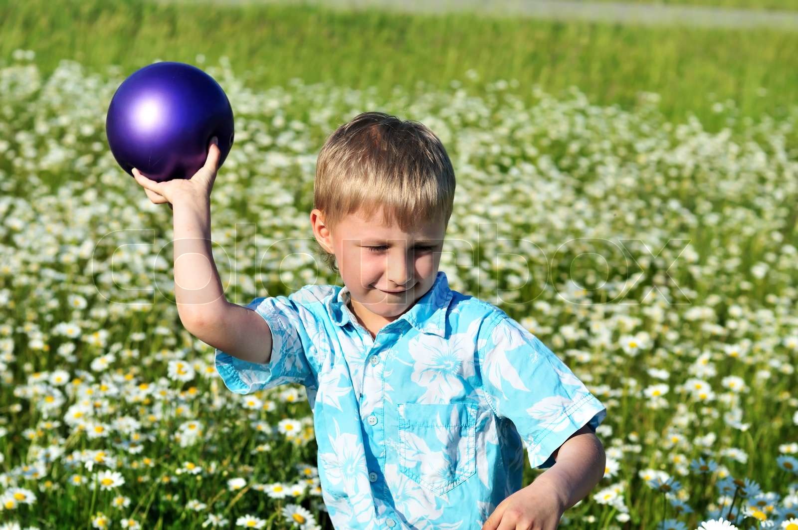 boy dropping ball | Stock image | Colourbox