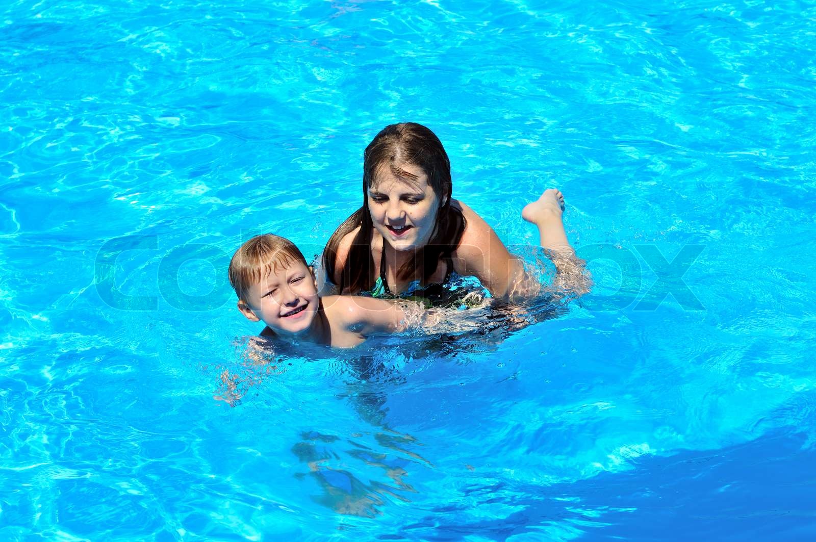 sister teaching brother to swim | Stock image | Colourbox