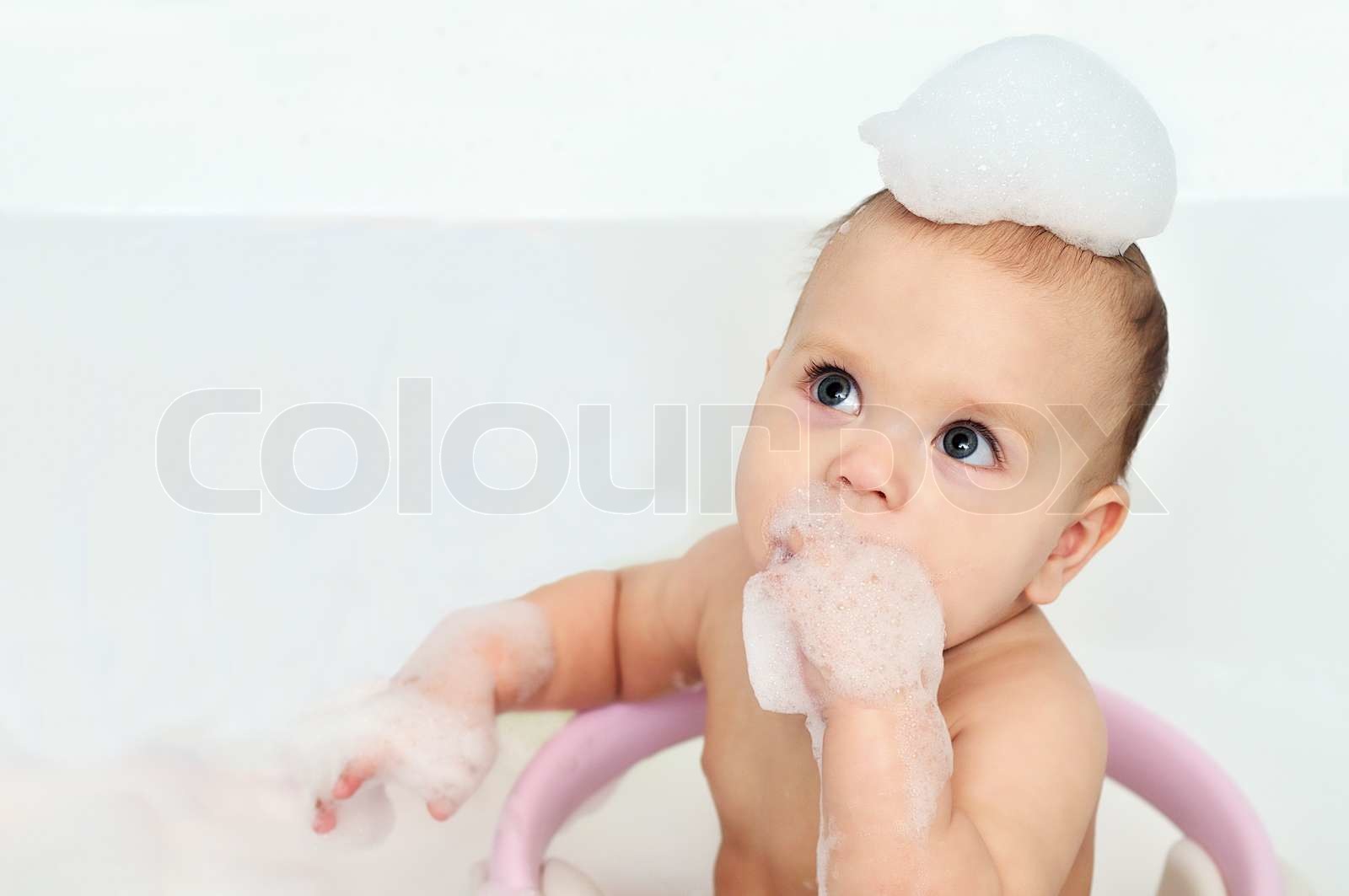 bathing baby | Stock image | Colourbox