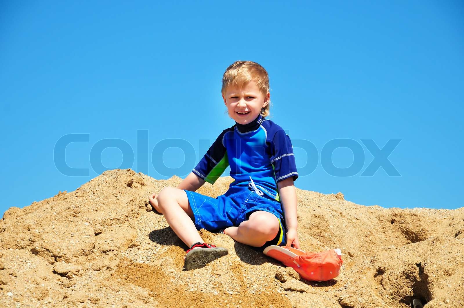 boy in sand | Stock image | Colourbox