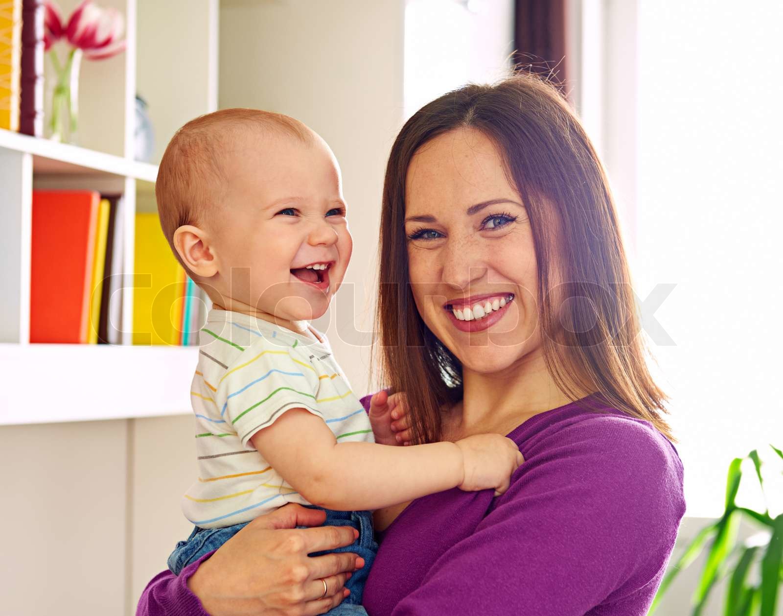smiley mother and adorable son at home | Stock image | Colourbox