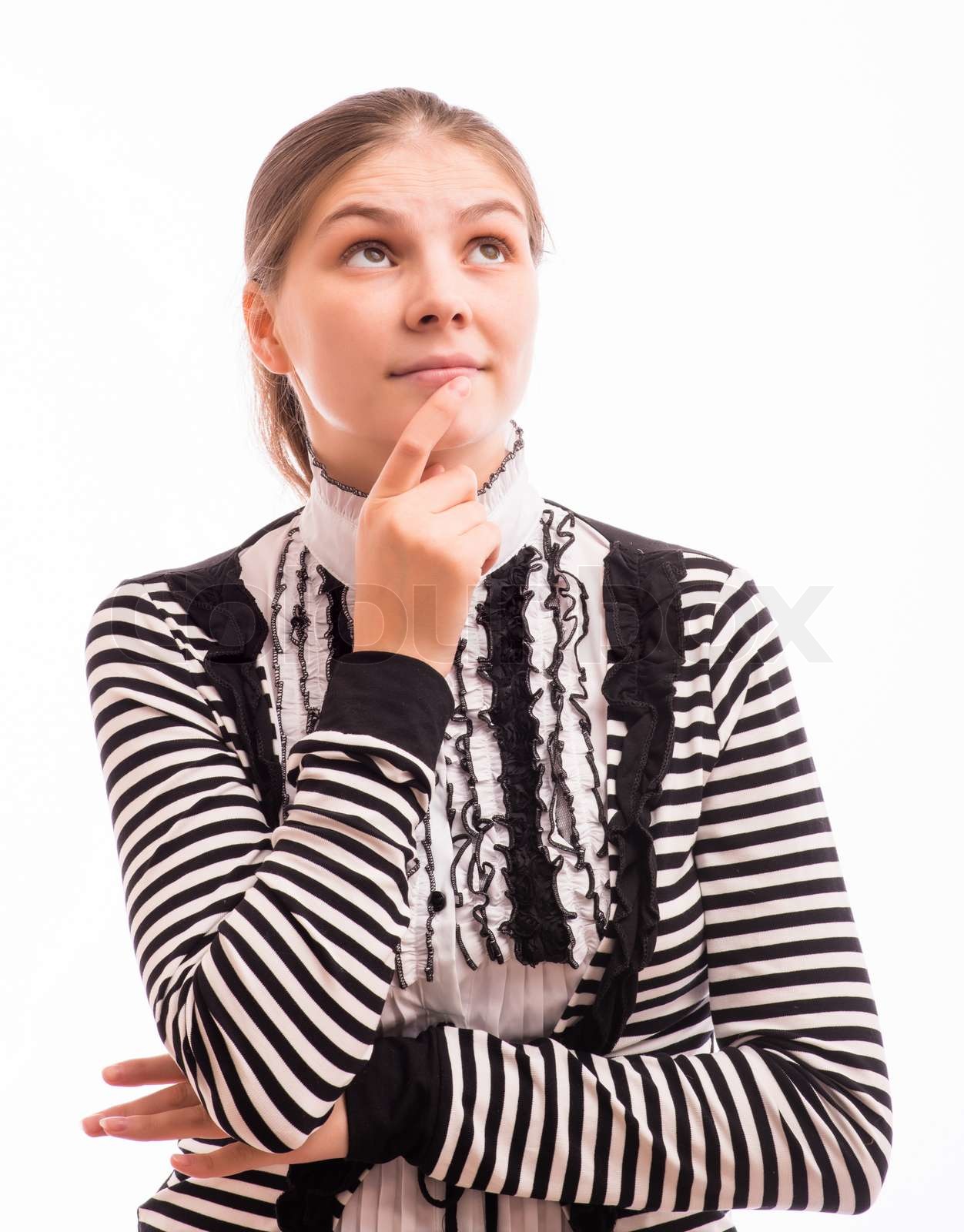 Woman Peaking gennem hænderne på hendes ansigt | Stock foto | Colourbox