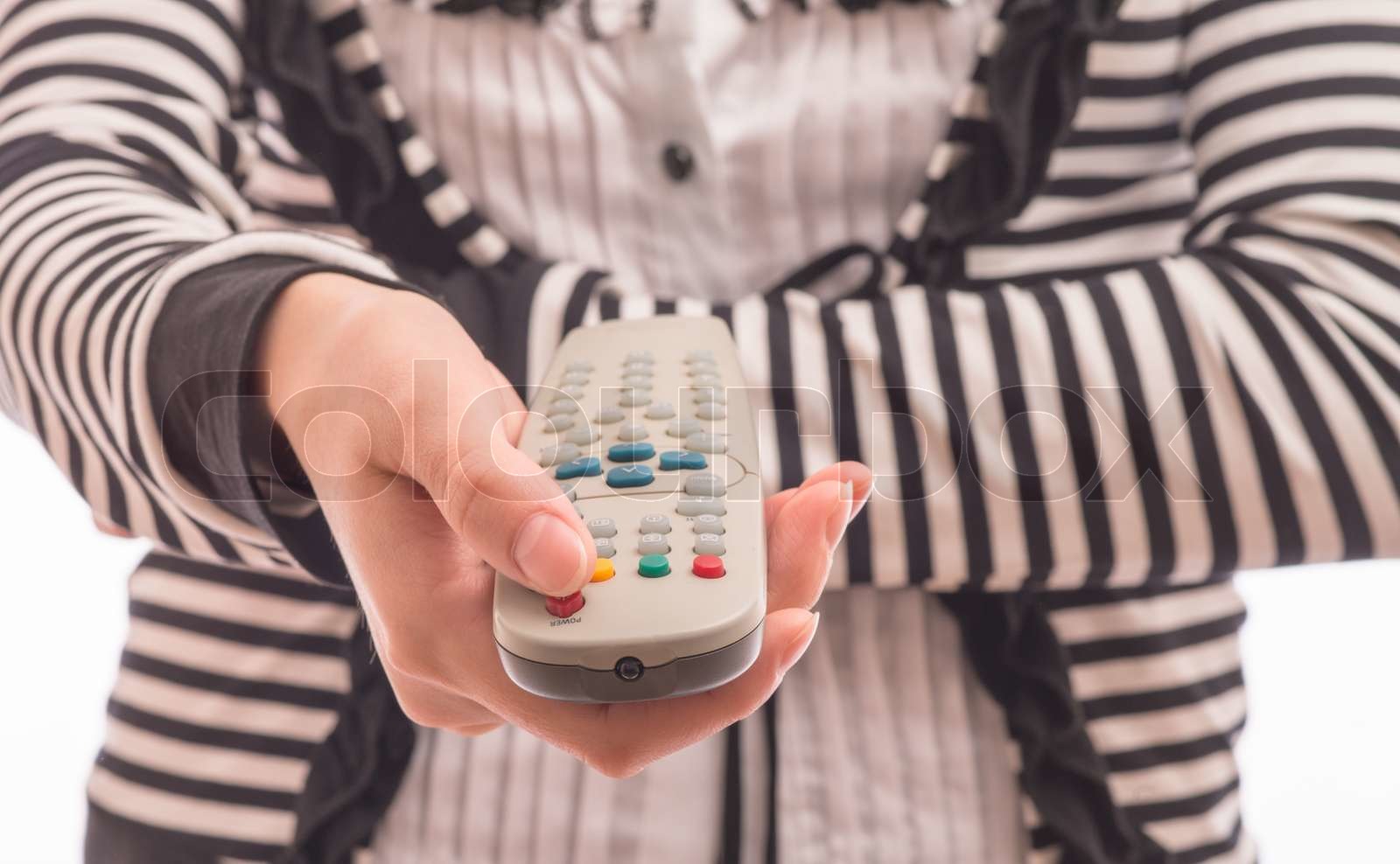 Woman with remote control | Stock image | Colourbox