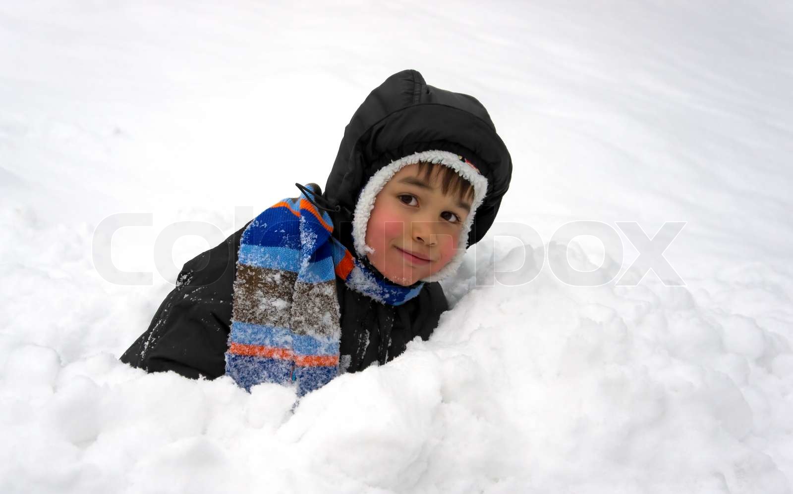Little boy in snow | Stock image | Colourbox