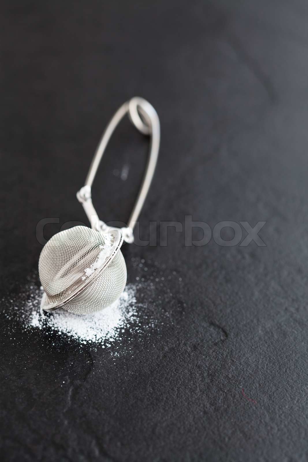 Sieve and icing sugar | Stock image | Colourbox