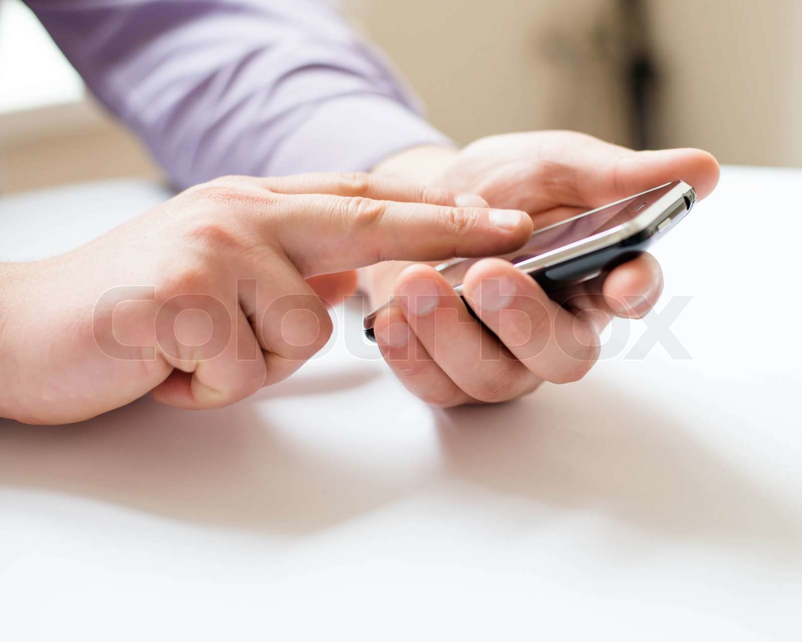 Man Holding And Uses A Mobile Phone Stock Image Colourbox