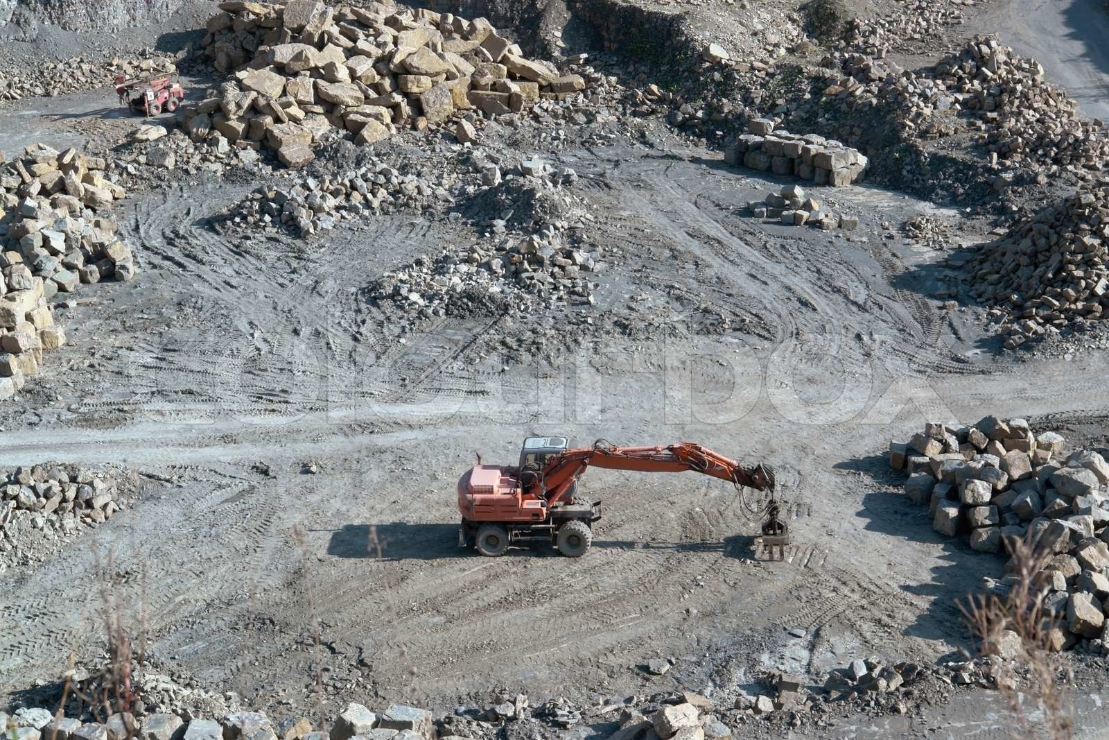 resting quarry digger and stones | Stock image | Colourbox