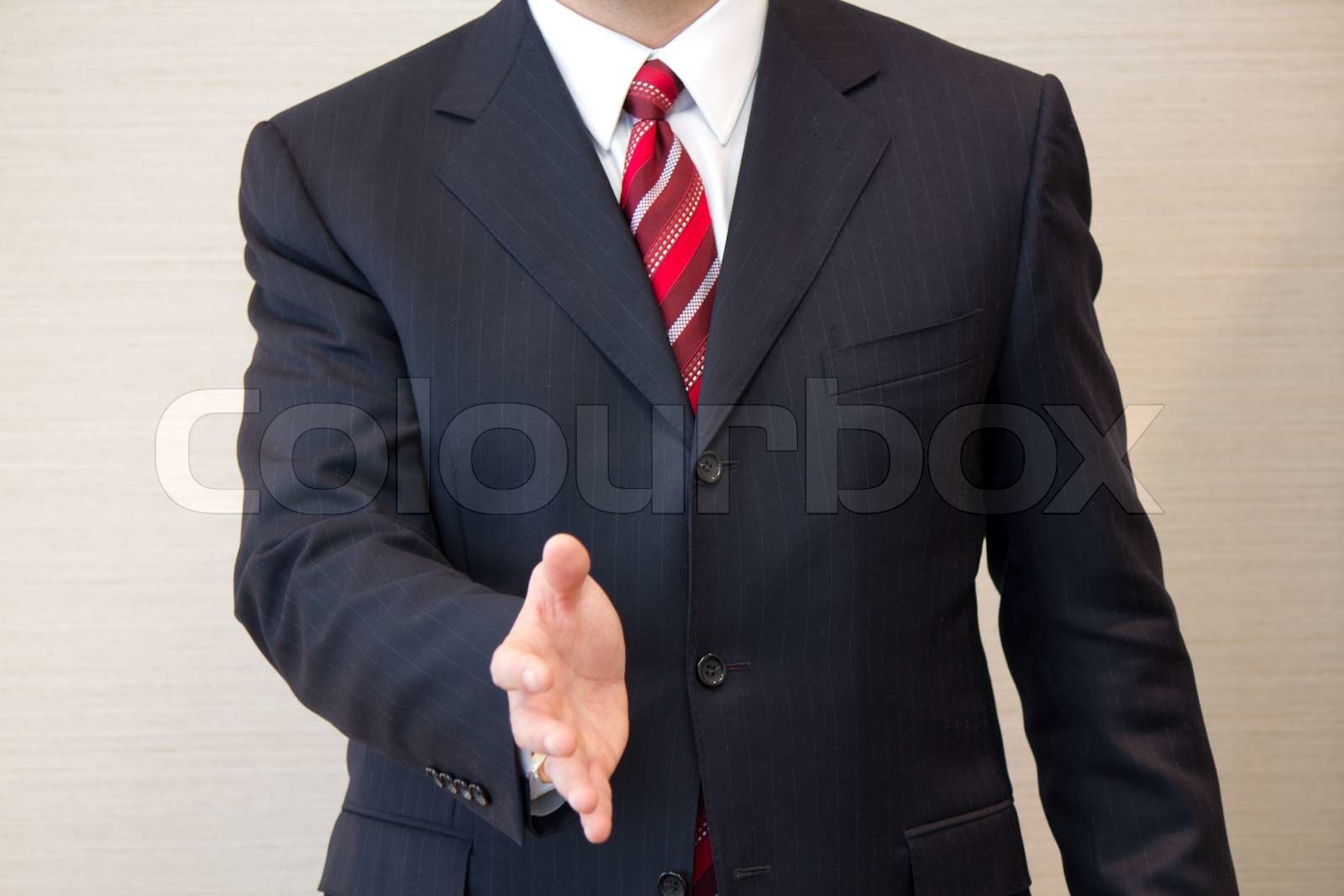Business man offering a handshake | Stock image | Colourbox