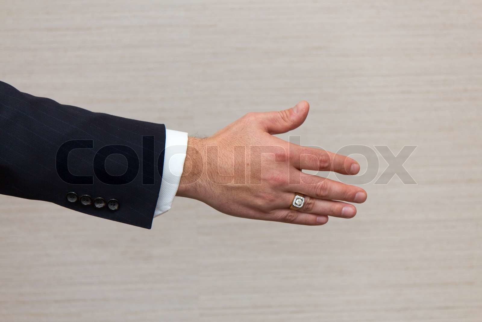 Business man offering a handshake | Stock image | Colourbox